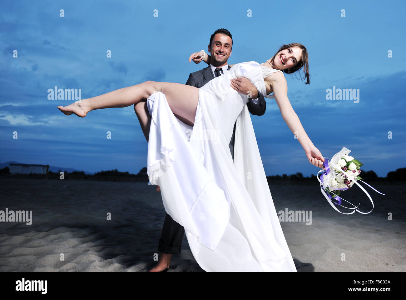 happy just married young couple celebrating and have fun at beautiful ...