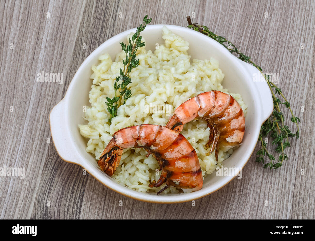 Italian trditional Risotto with tiger prawn and thyme Stock Photo - Alamy