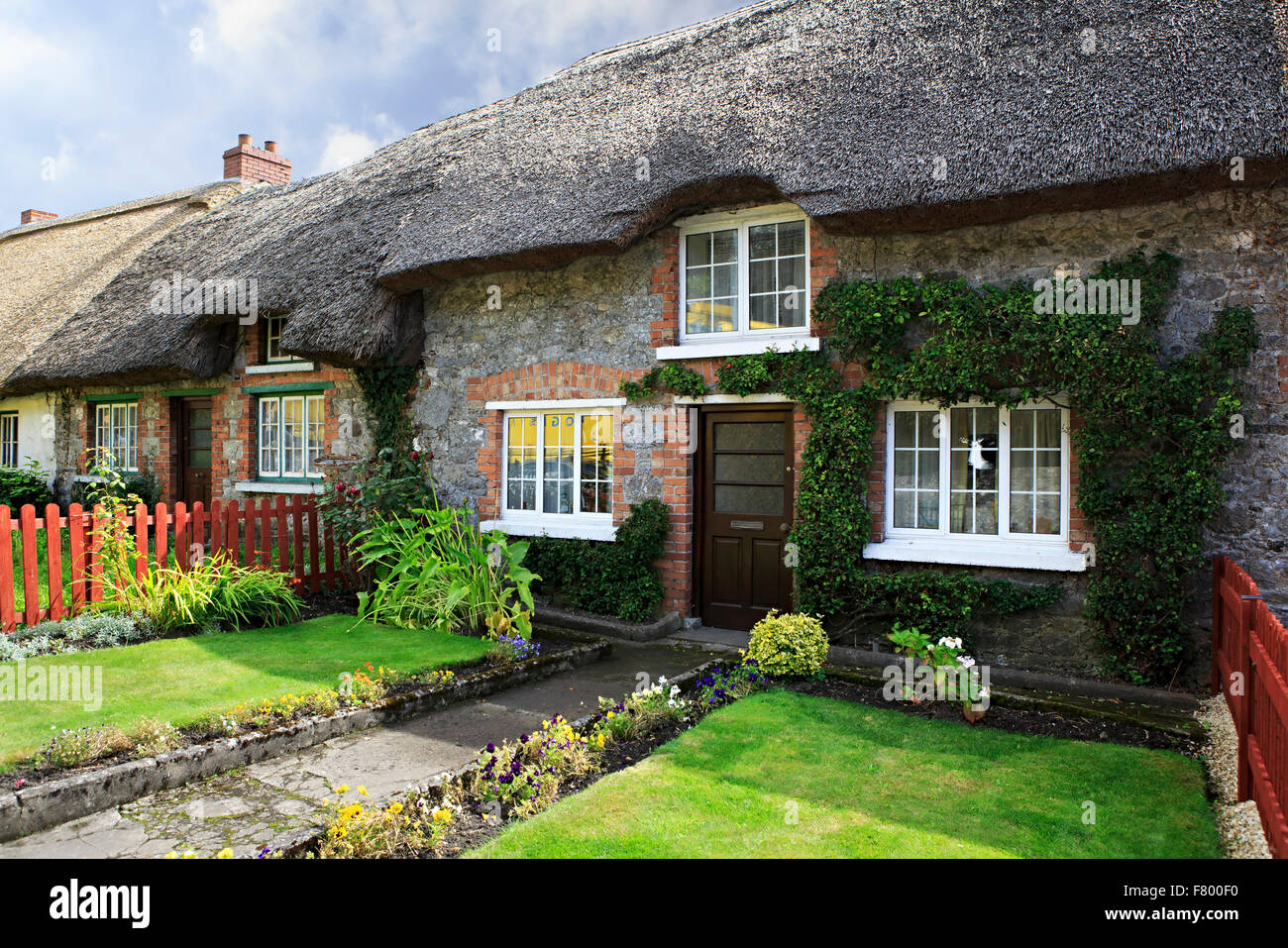 Thatched roof houses in the background hi-res stock photography and ...