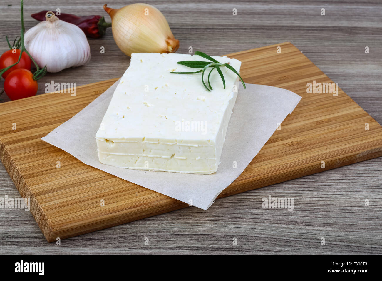 Traditional Caucasian homemade Cheese Brinza with rosemary on wood ...