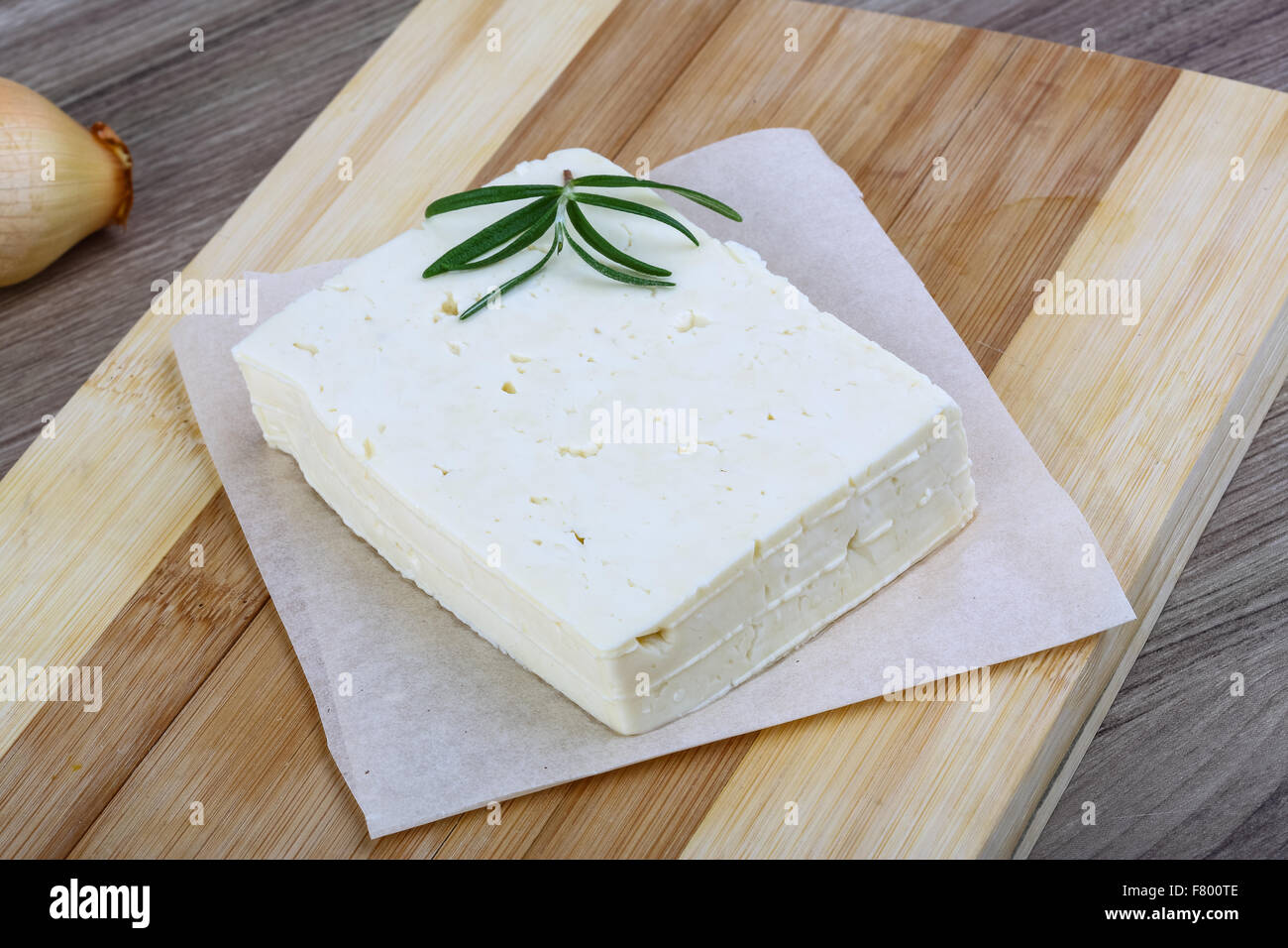 Traditional Caucasian homemade Cheese Brinza with rosemary on wood ...