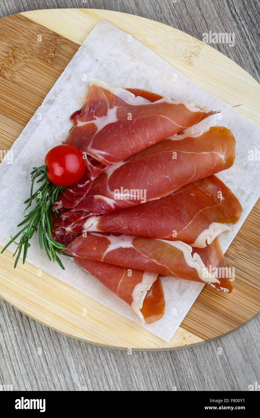 Spanish traditional snack - Jamon with tomato and rosemary Stock Photo ...