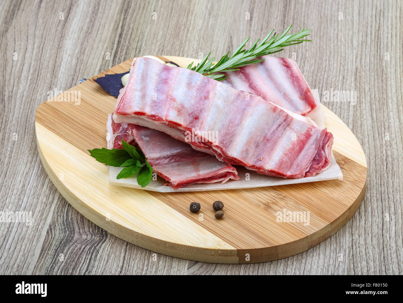 Fresh cold Raw lamb ribs with garlik and pepper - ready for cooking ...