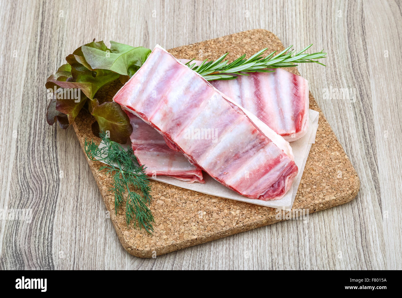 Fresh cold Raw lamb ribs with garlik and pepper - ready for cooking ...