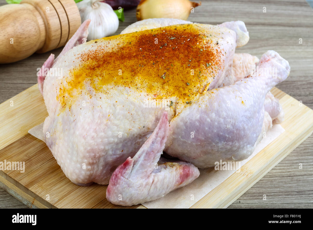 Raw chicken with spices ready for cooking Stock Photo - Alamy