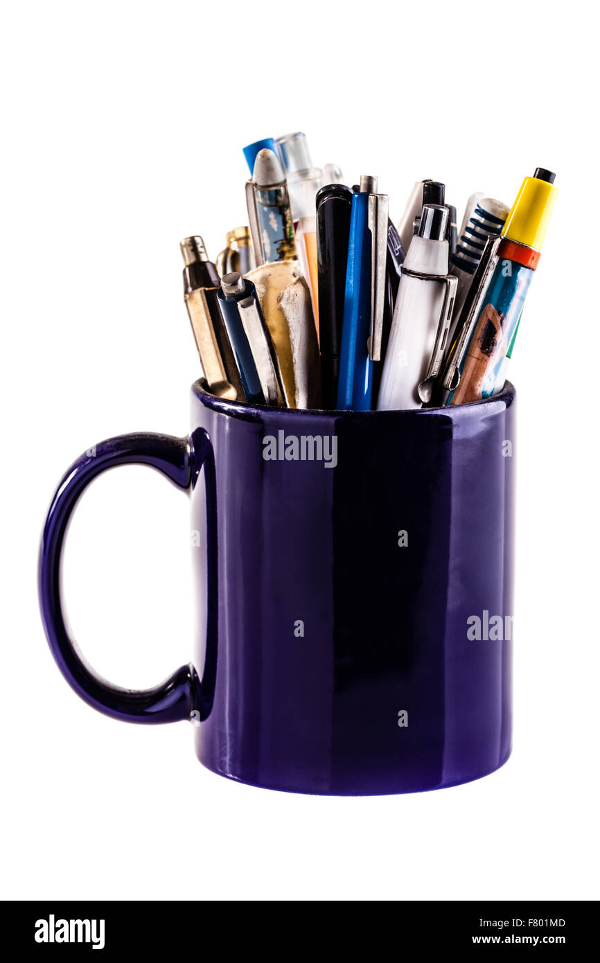 a blue mug full of pens and pencils isolated over a white background ...