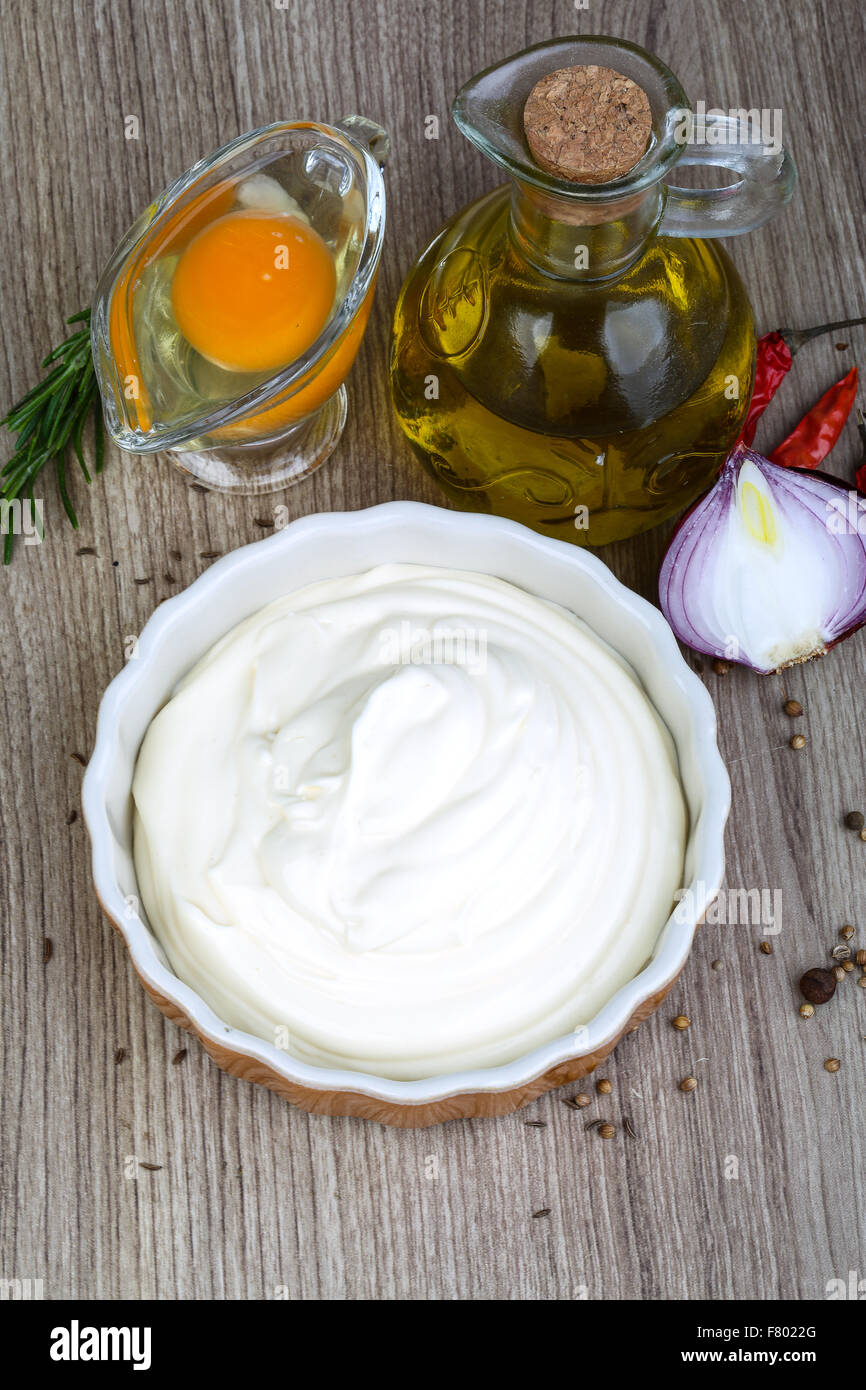 Mayonnaise sauce served raw egg, olive oil and rosemary Stock Photo - Alamy