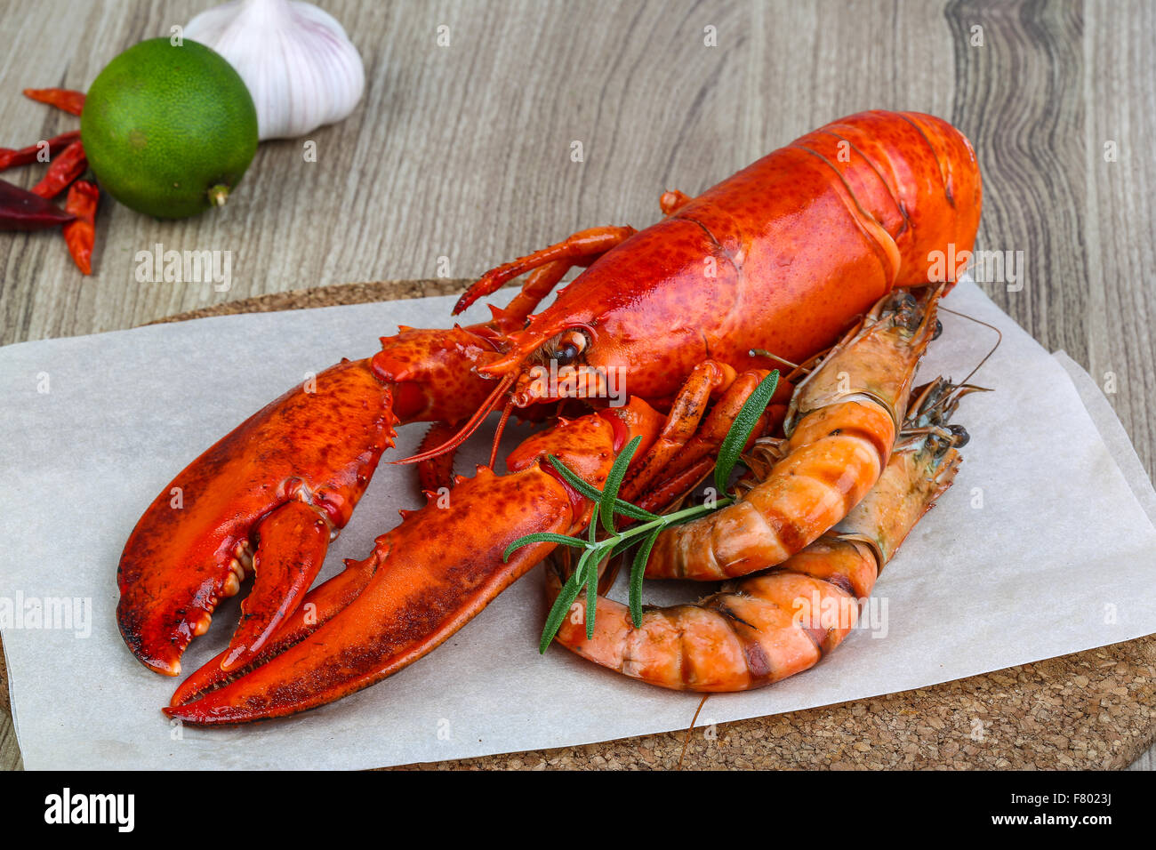 Big cooked lobster and tiger shrimps ready for eating Stock Photo - Alamy