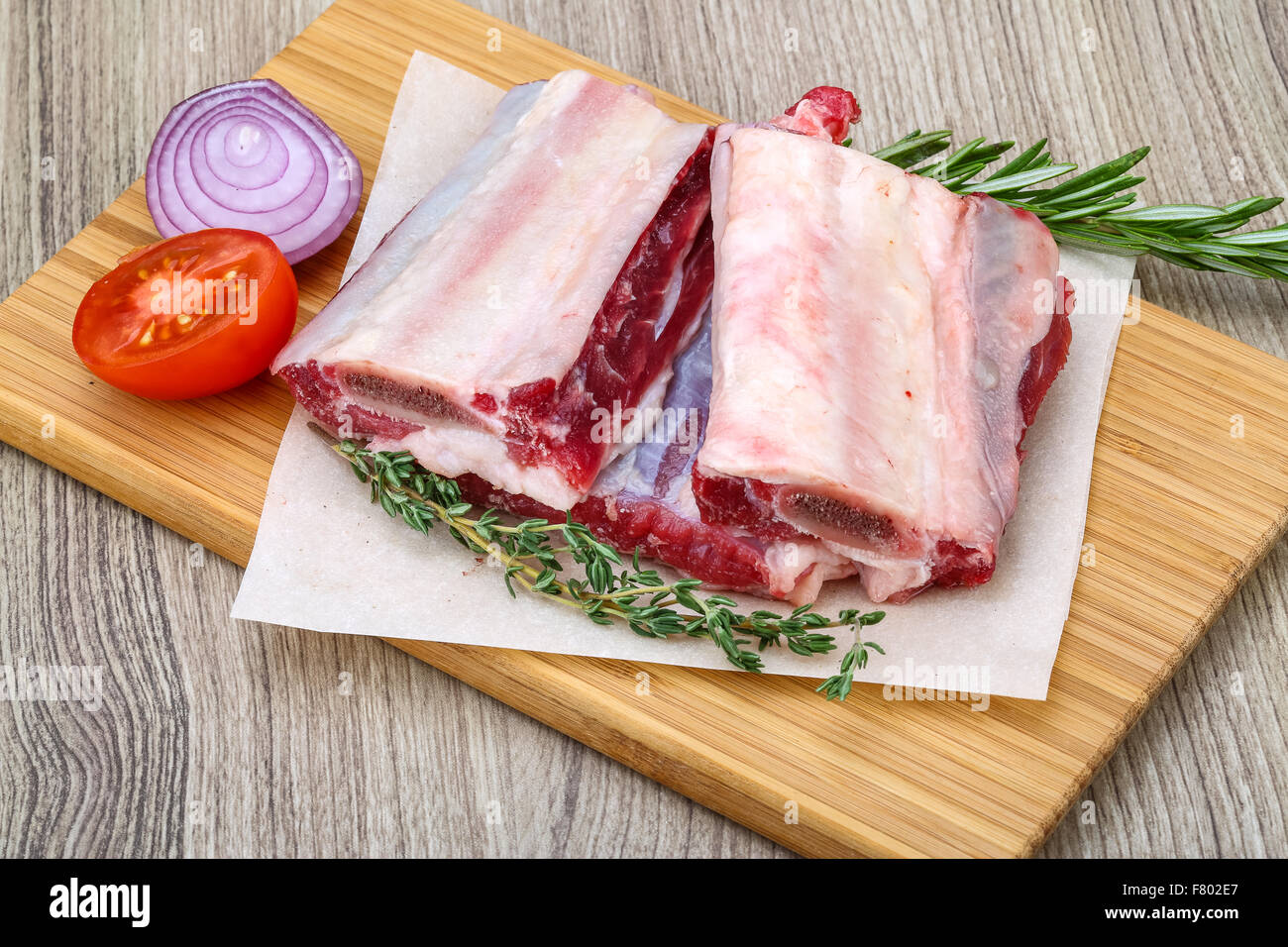 Raw beef ribs with rosemary and thyme - ready for cooking Stock Photo ...