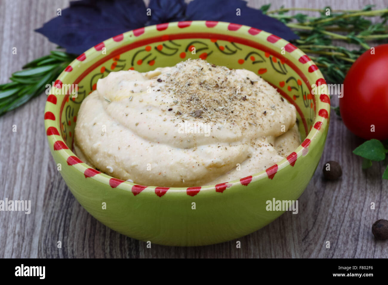 Arabic traditional cusine - hummus with olive oil, herbs and spices ...