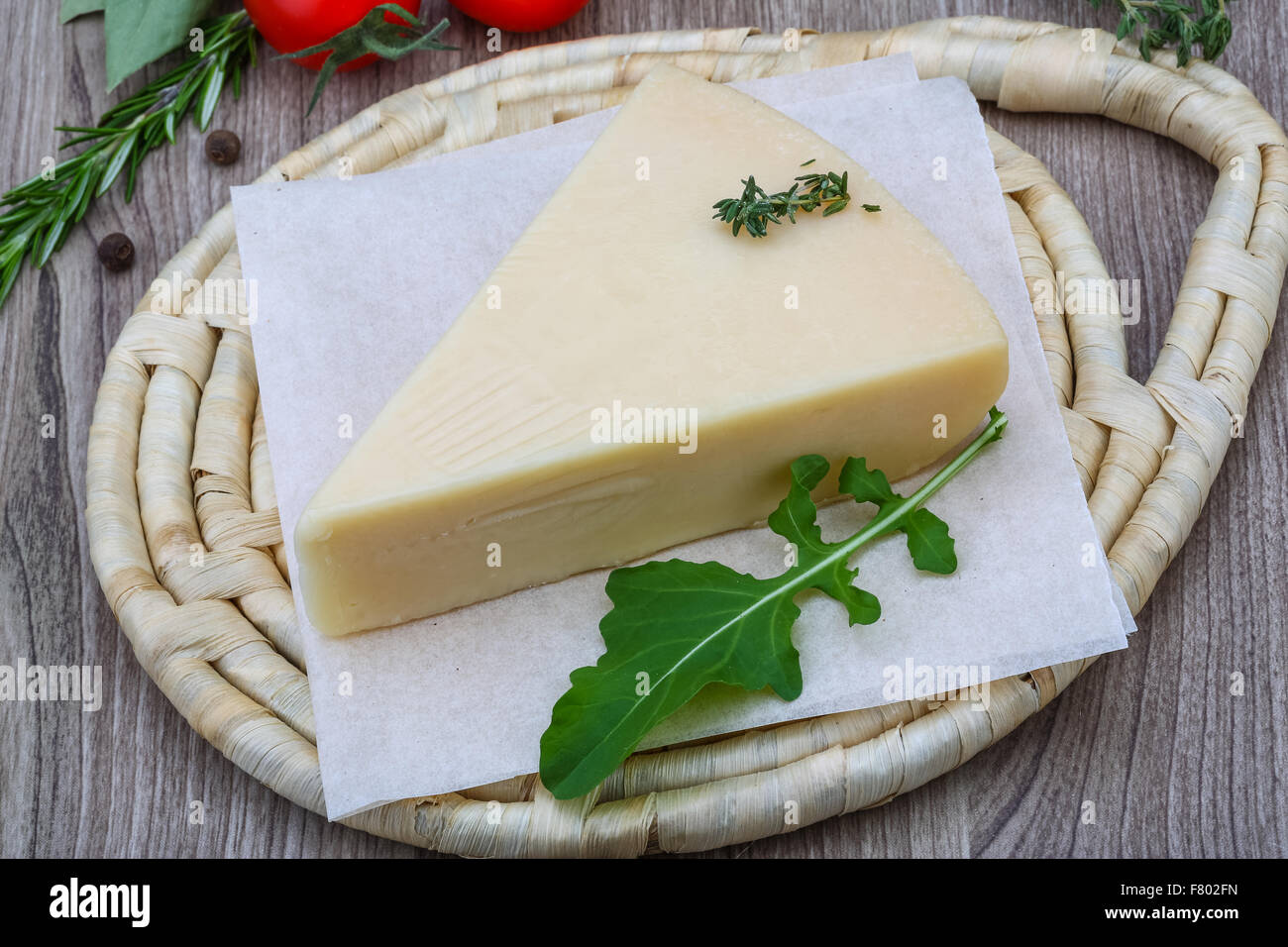 Italian trditional Parmesan cheese with herbs and tomato cherry Stock ...