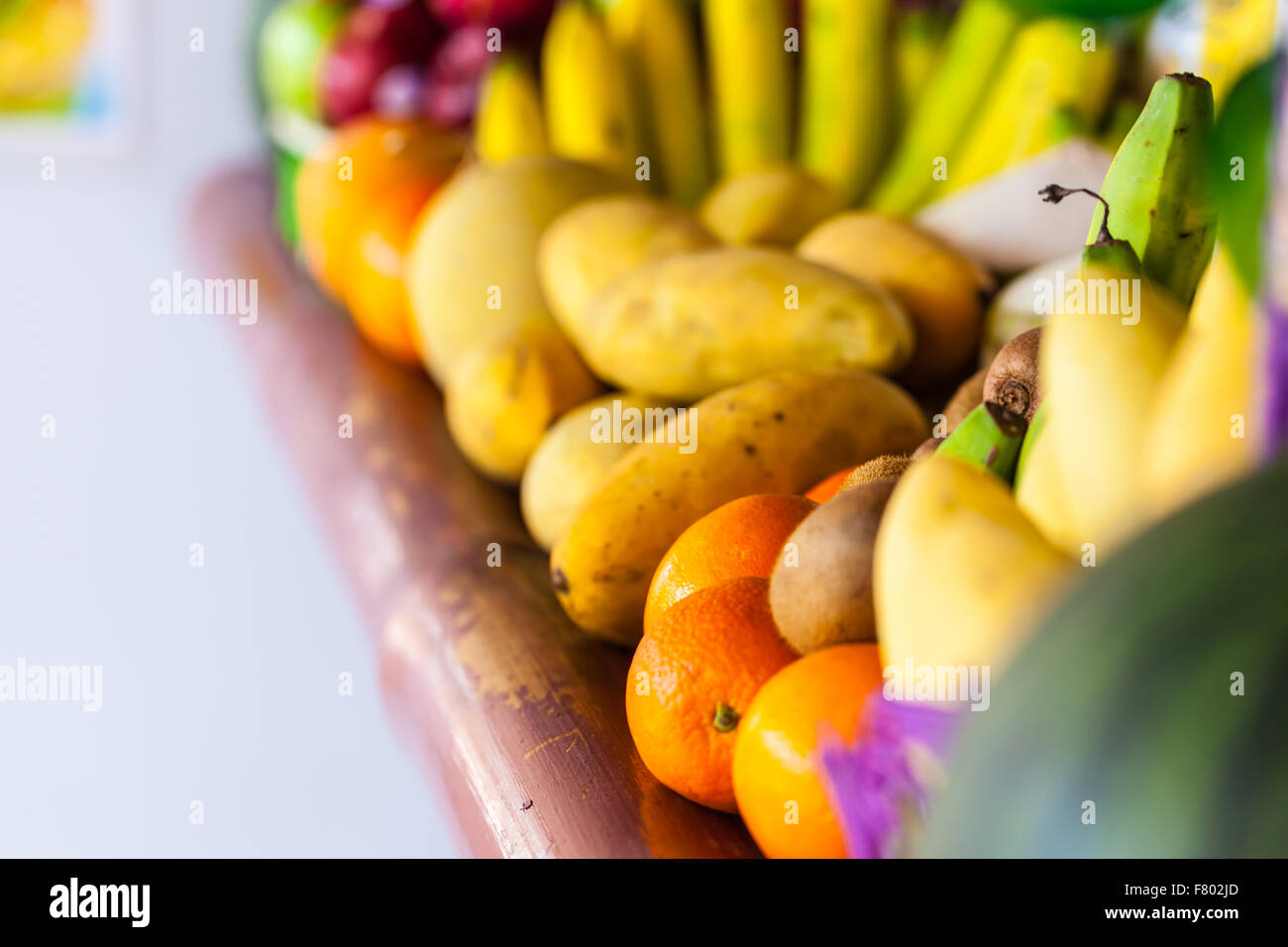 different vivid colored fruits on sale in a thai fruit stand Stock ...