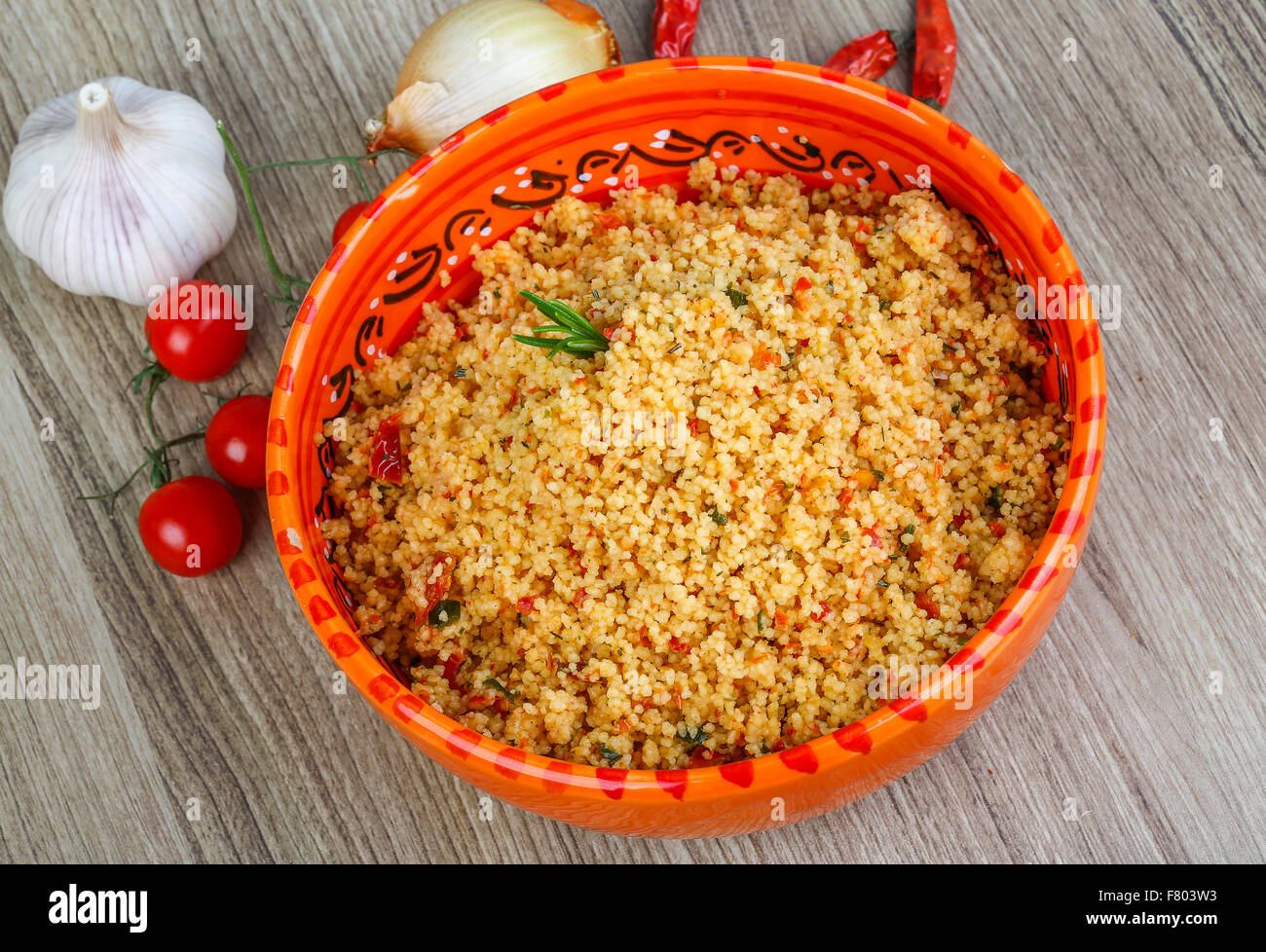 Arabic traditional cuisine - Couscous with tomato and green onion Stock ...