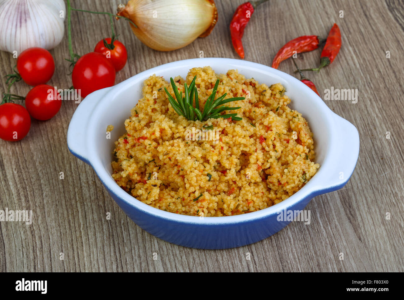 Arabic traditional cuisine - Couscous with tomato and green onion Stock ...