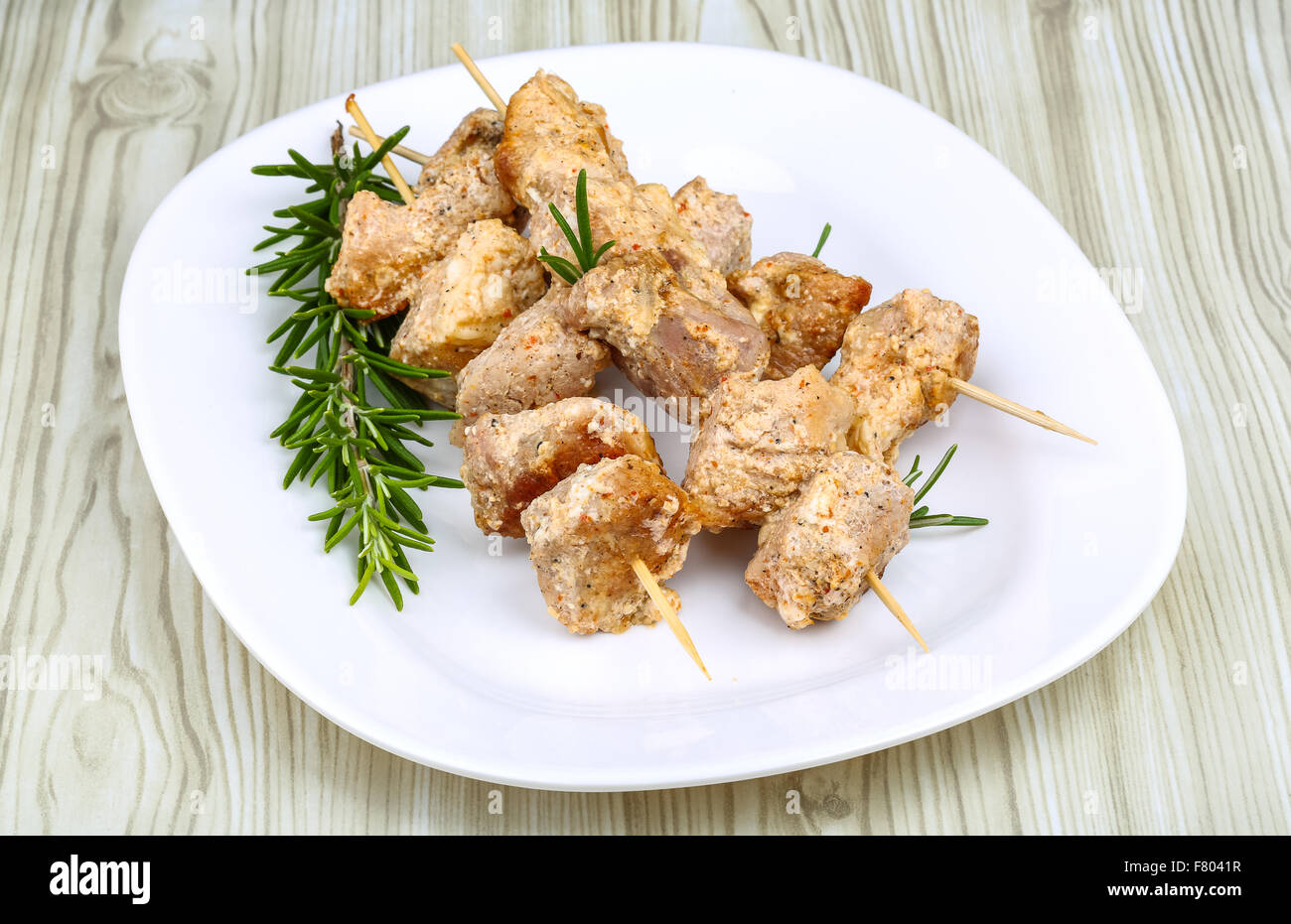 Chicken skewers with rosemary on the wwod background Stock Photo - Alamy