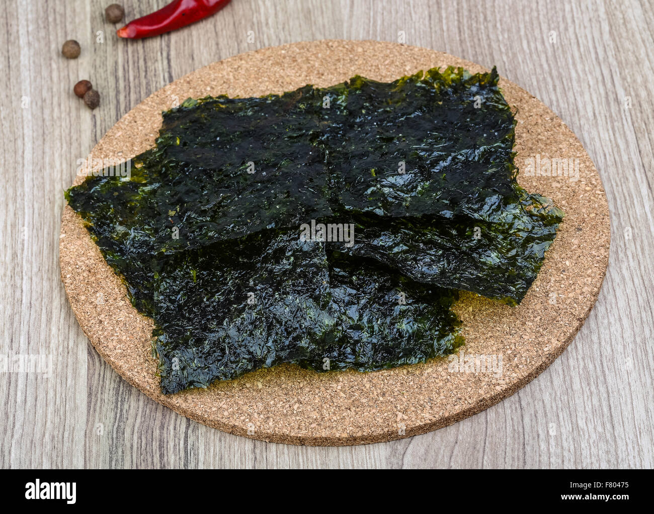 Korean traditional snack - Nori seaweed sheets on the wood background ...