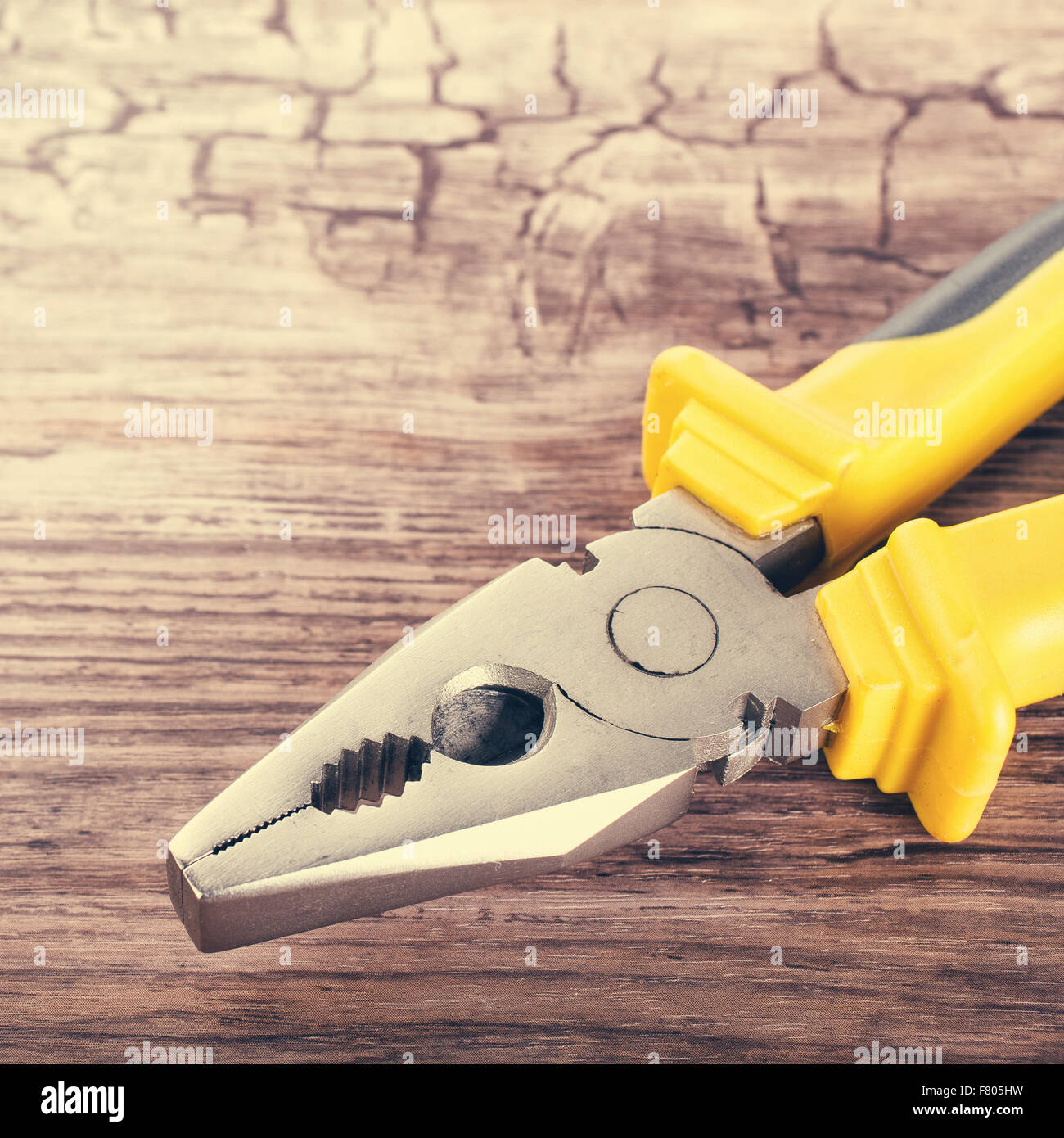 multitool pliers on wooden background Stock Photo - Alamy