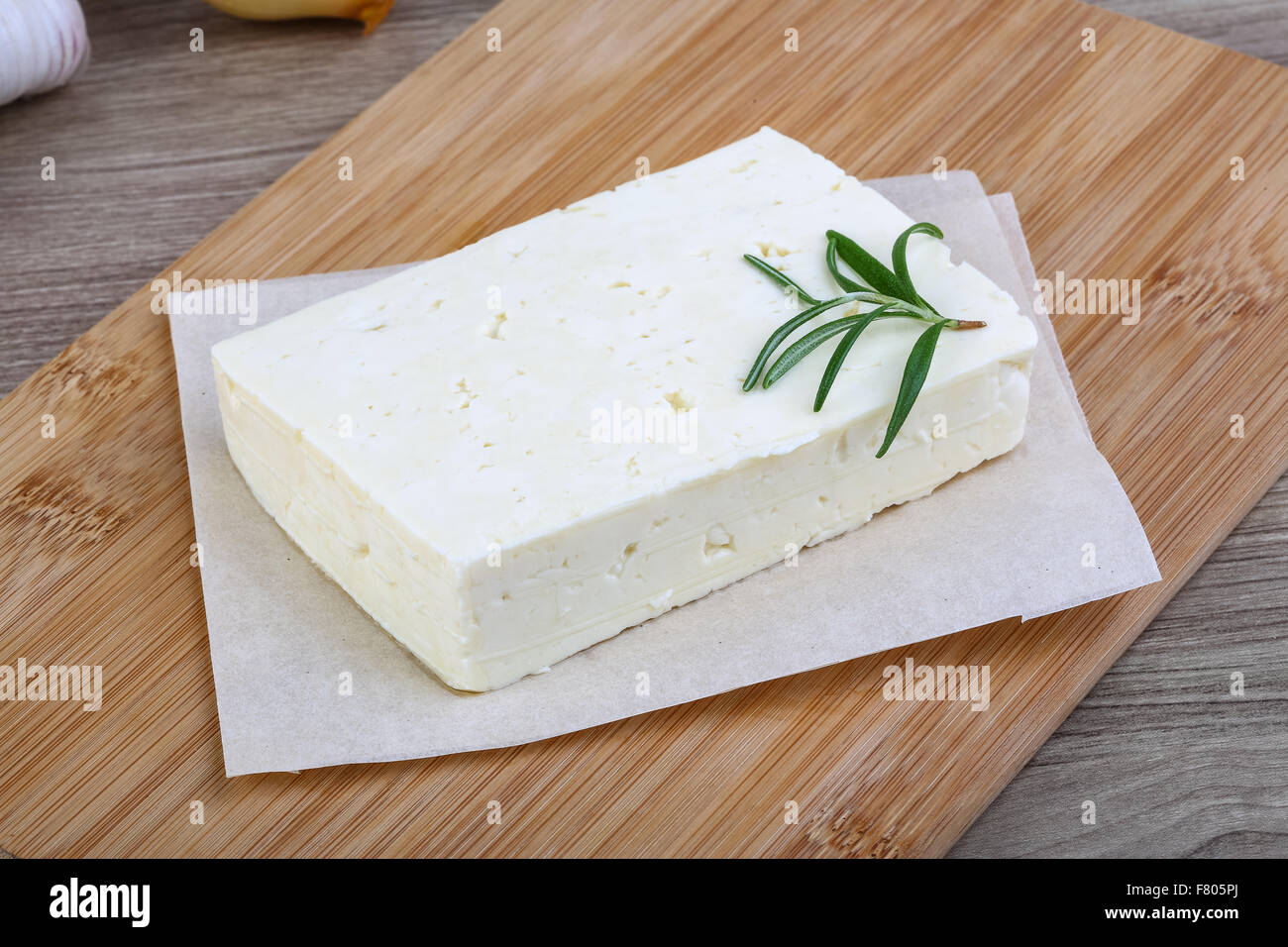 Traditional Caucasian homemade Cheese Brinza with rosemary on wood ...