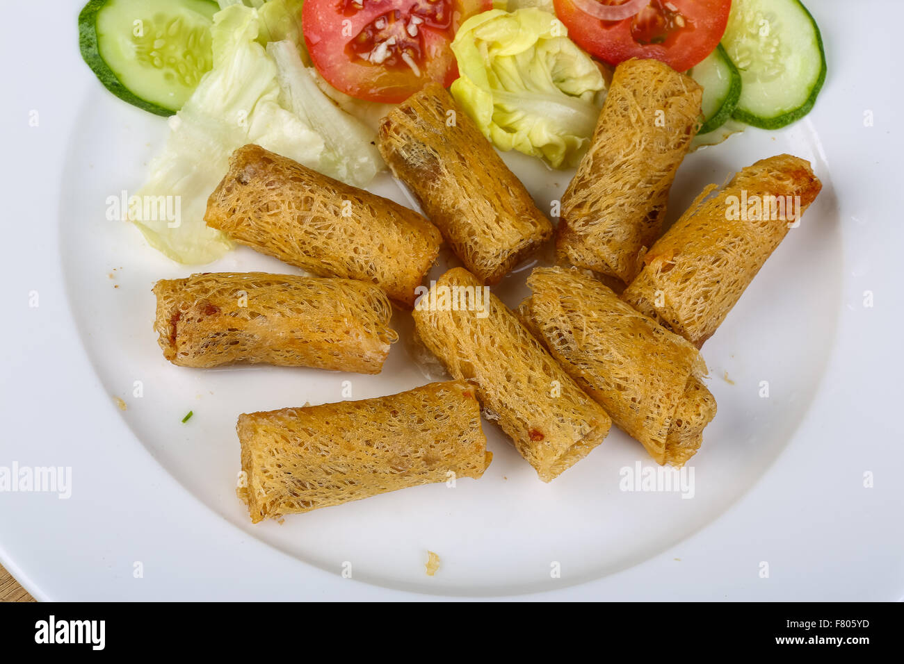Asian traditional spring rolls on the wood background Stock Photo - Alamy