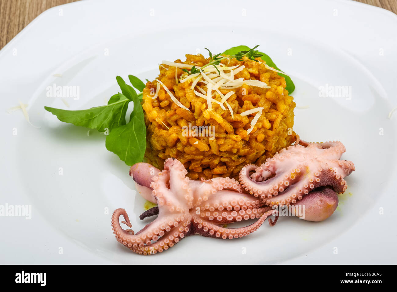 Seafood risotto with octopus, cheese and thyme leaf Stock Photo - Alamy