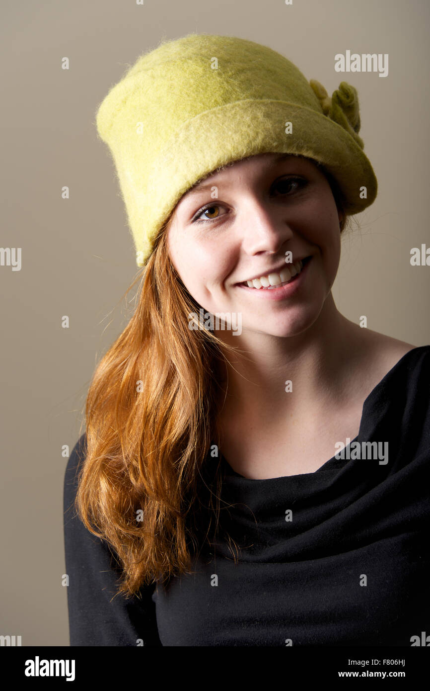 Smiling redhead with dimples in green hat Stock Photo - Alamy