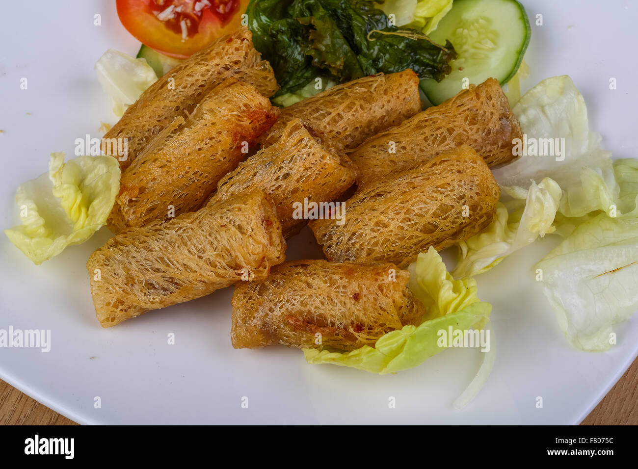 Asian traditional spring rolls on the wood background Stock Photo - Alamy