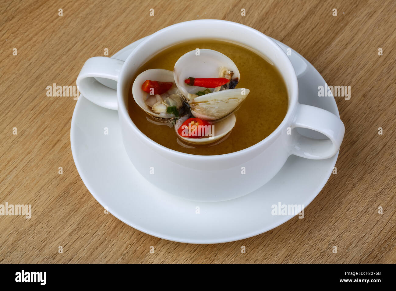 Asian traditional Shell soup on the wood background Stock Photo - Alamy