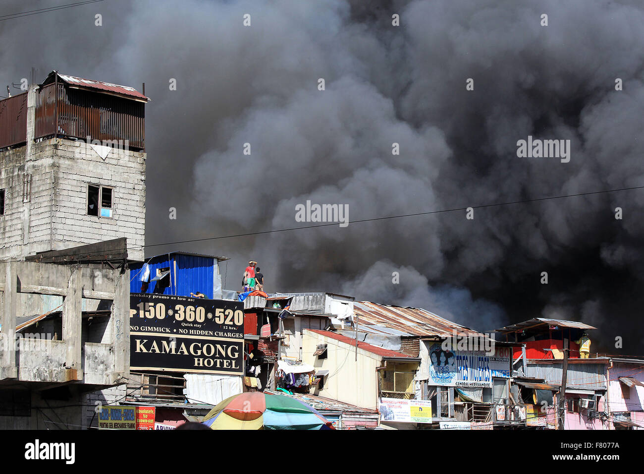 Manila, Philippines. 4th Dec, 2015. Smoke billows from a fire at a slum ...