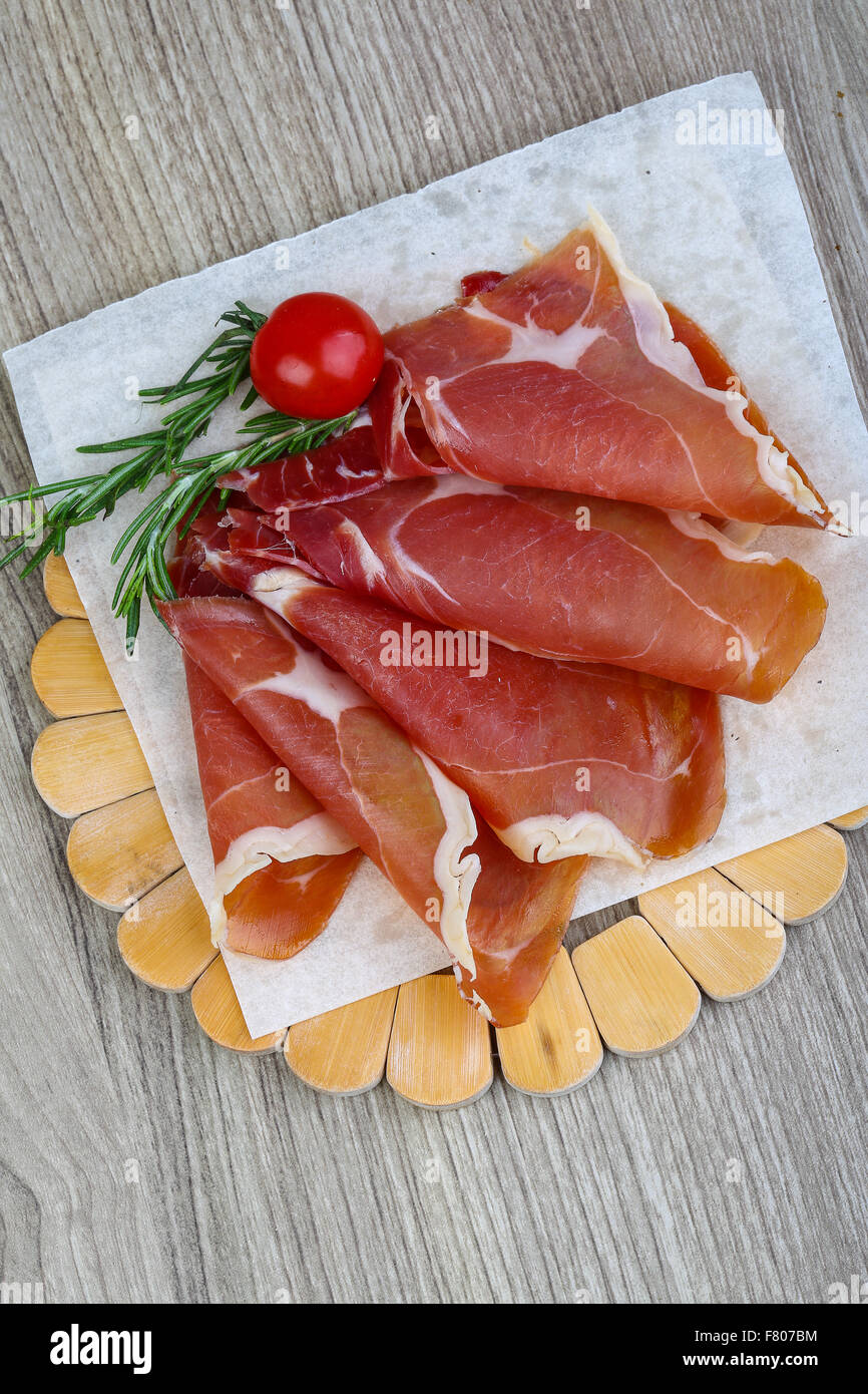 Spanish traditional snack - Jamon with tomato and rosemary Stock Photo ...