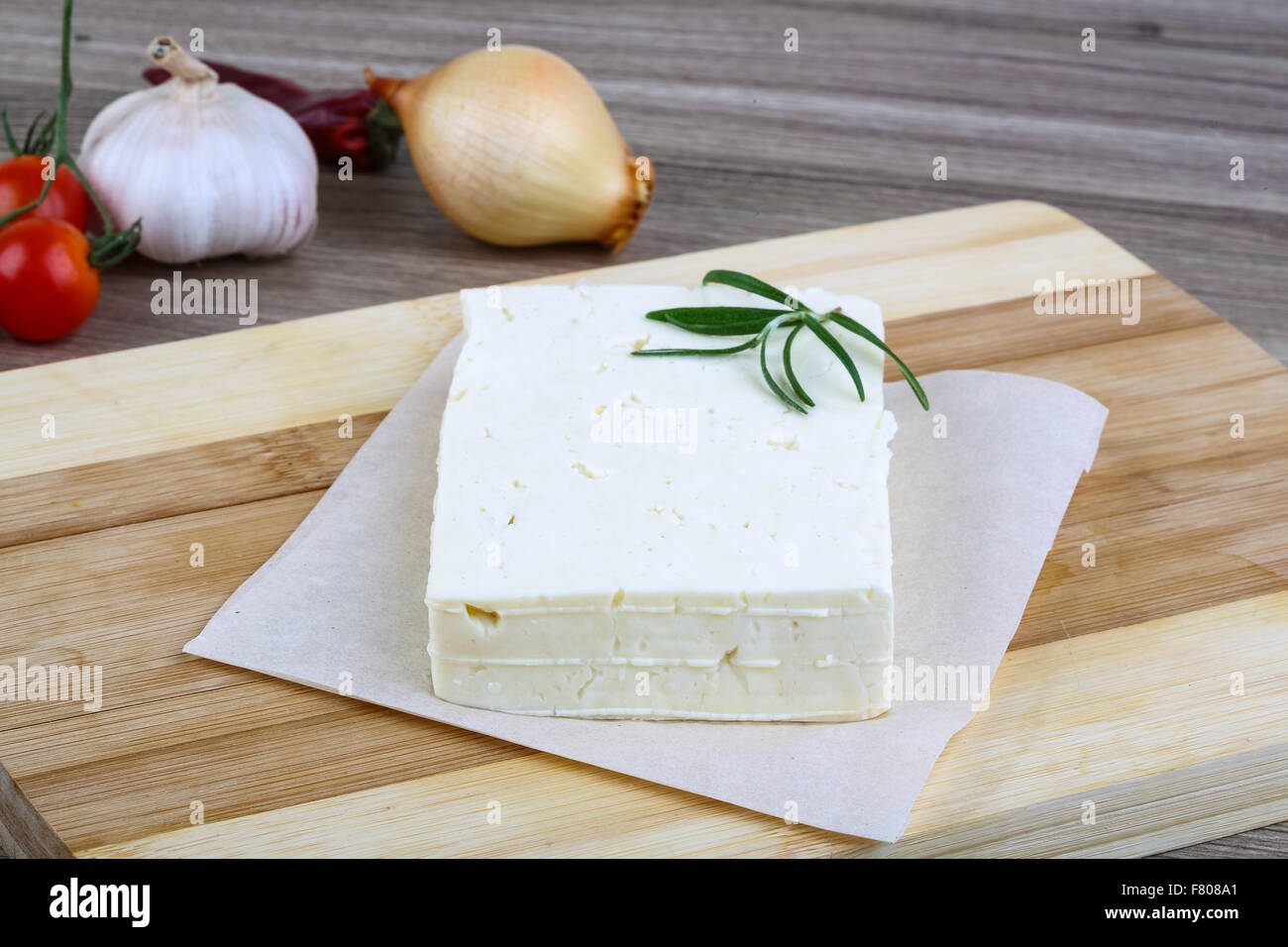 Traditional Caucasian homemade Cheese Brinza with rosemary on wood ...