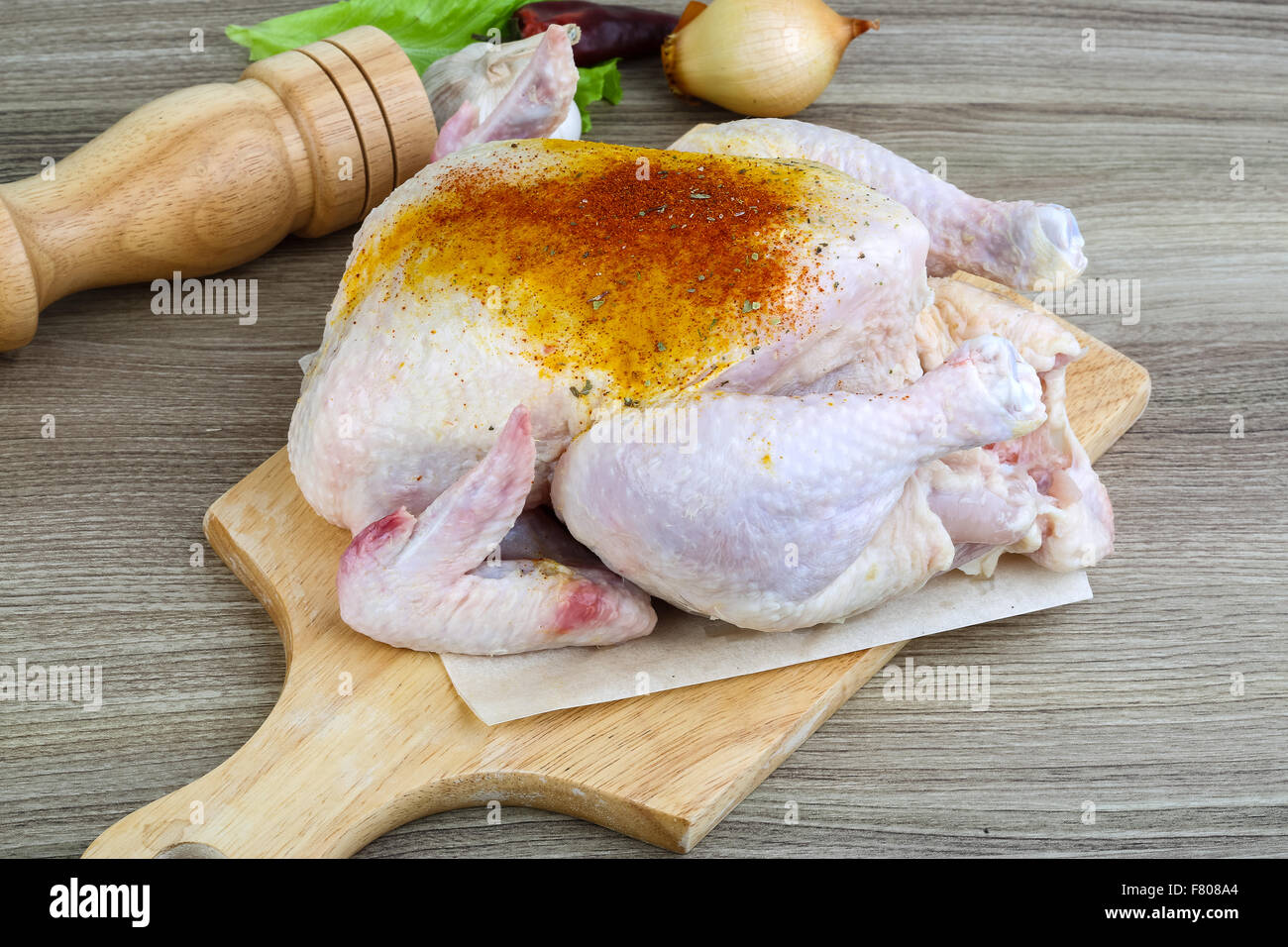 Raw chicken with spices ready for cooking Stock Photo - Alamy