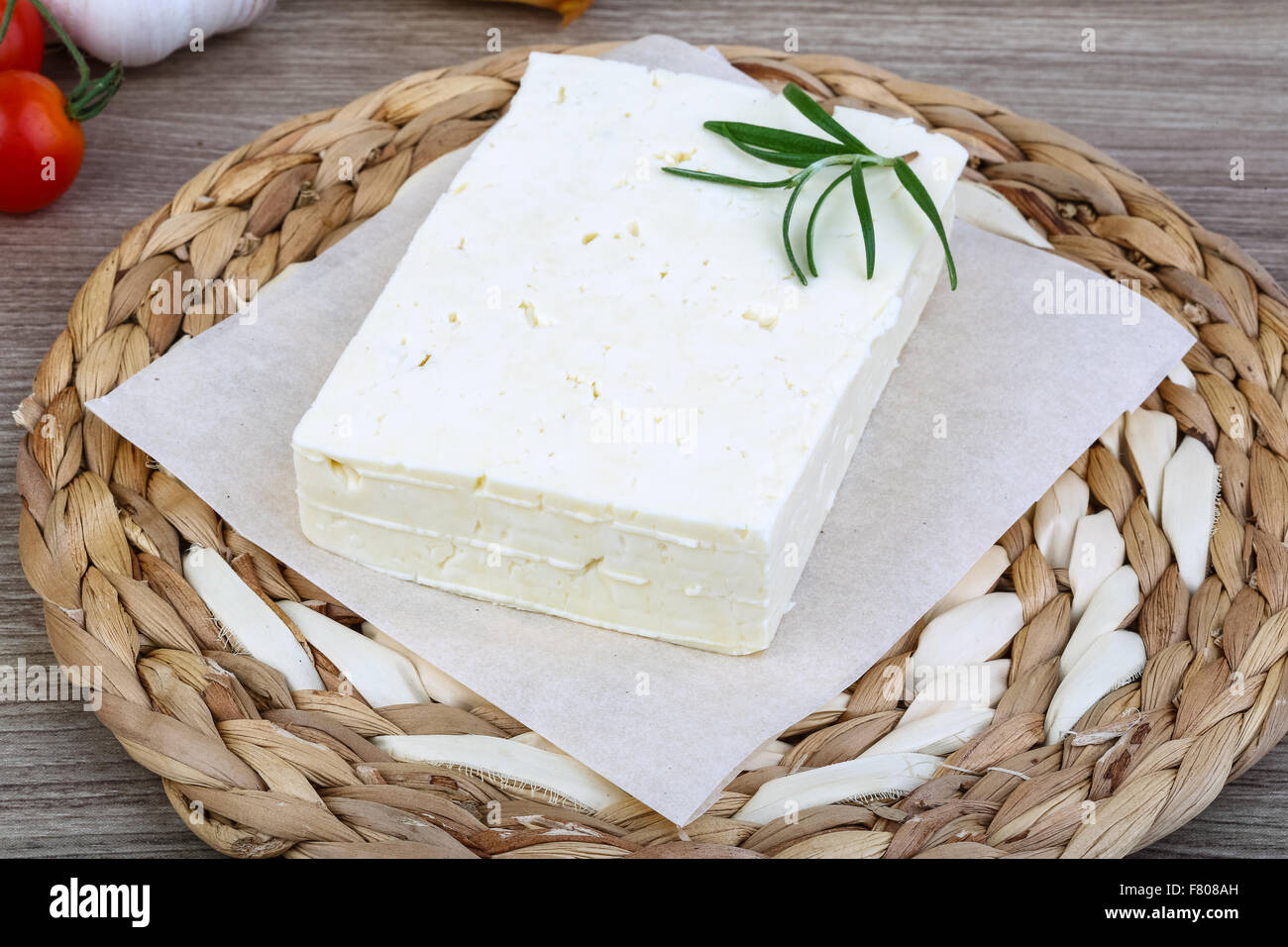 Traditional Caucasian homemade Cheese Brinza with rosemary on wood ...