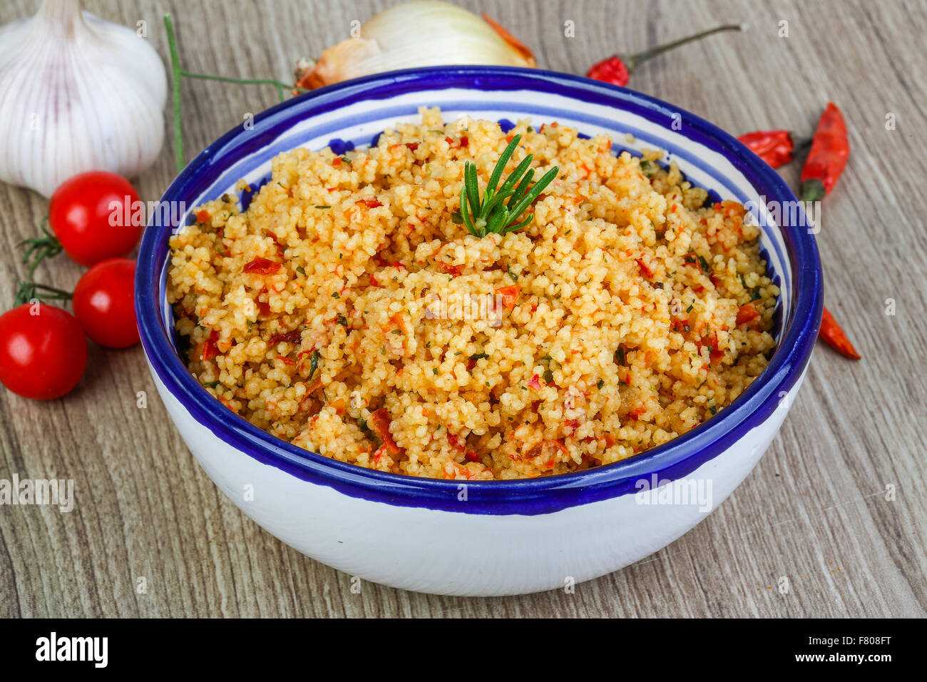 Arabic traditional cuisine - Couscous with tomato and green onion Stock ...