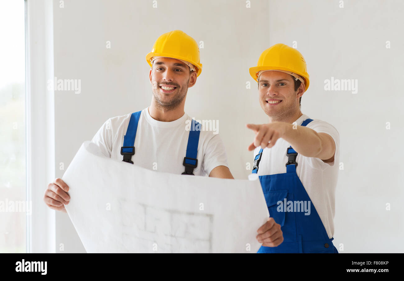 group of builders with blueprint Stock Photo - Alamy