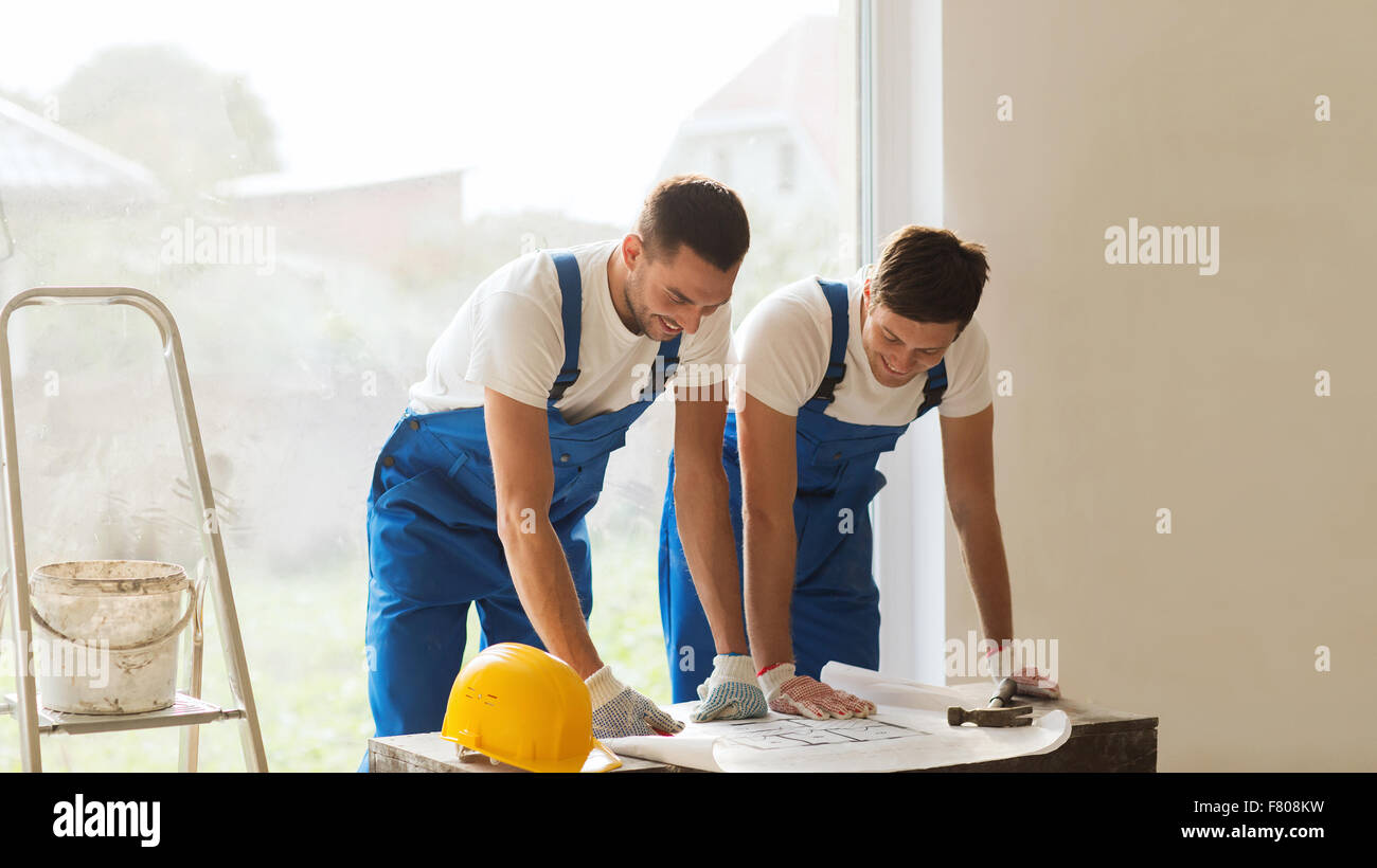group of builders with blueprint Stock Photo - Alamy