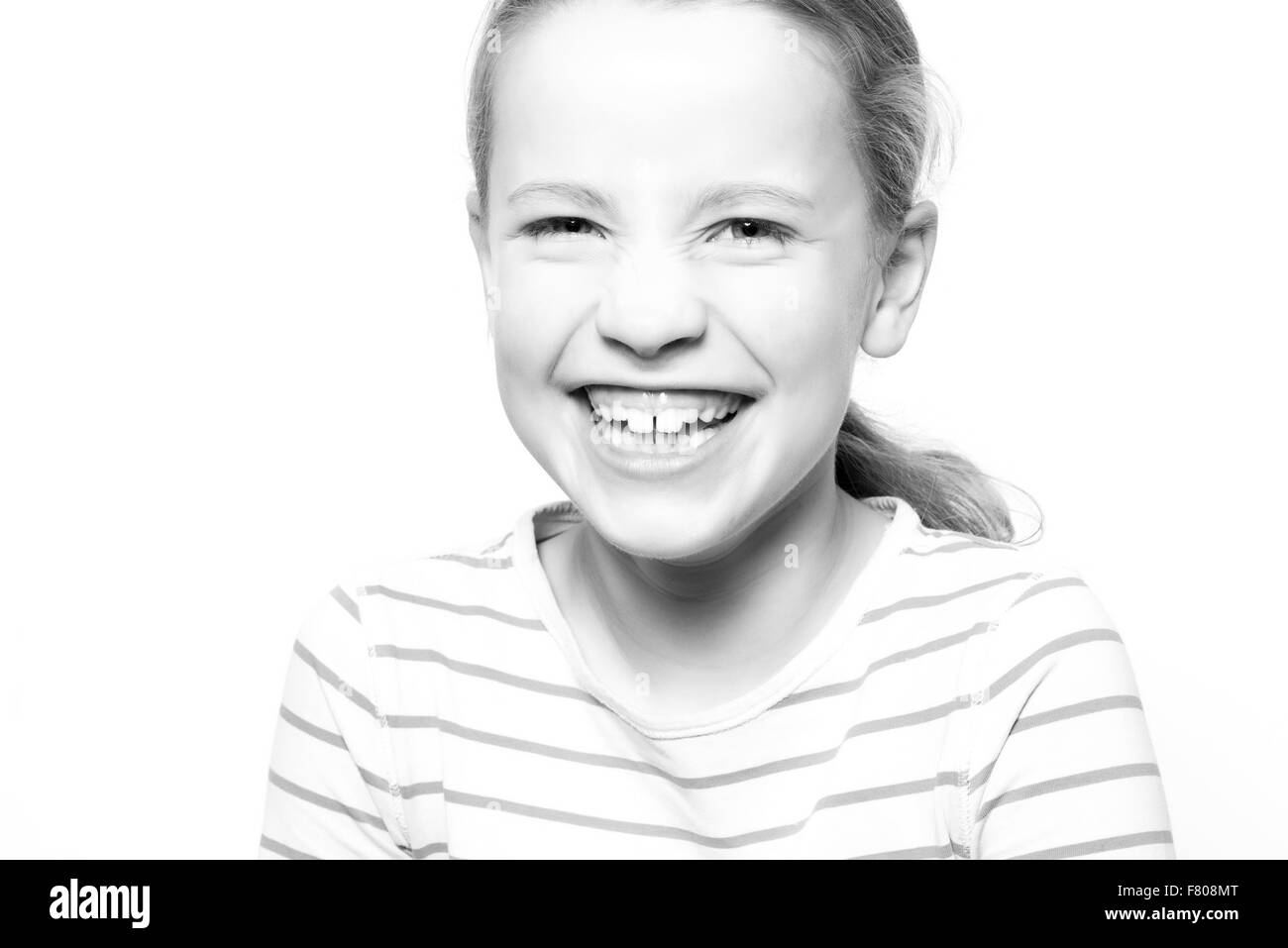 Portrait from a young girl in front of white background Stock Photo - Alamy