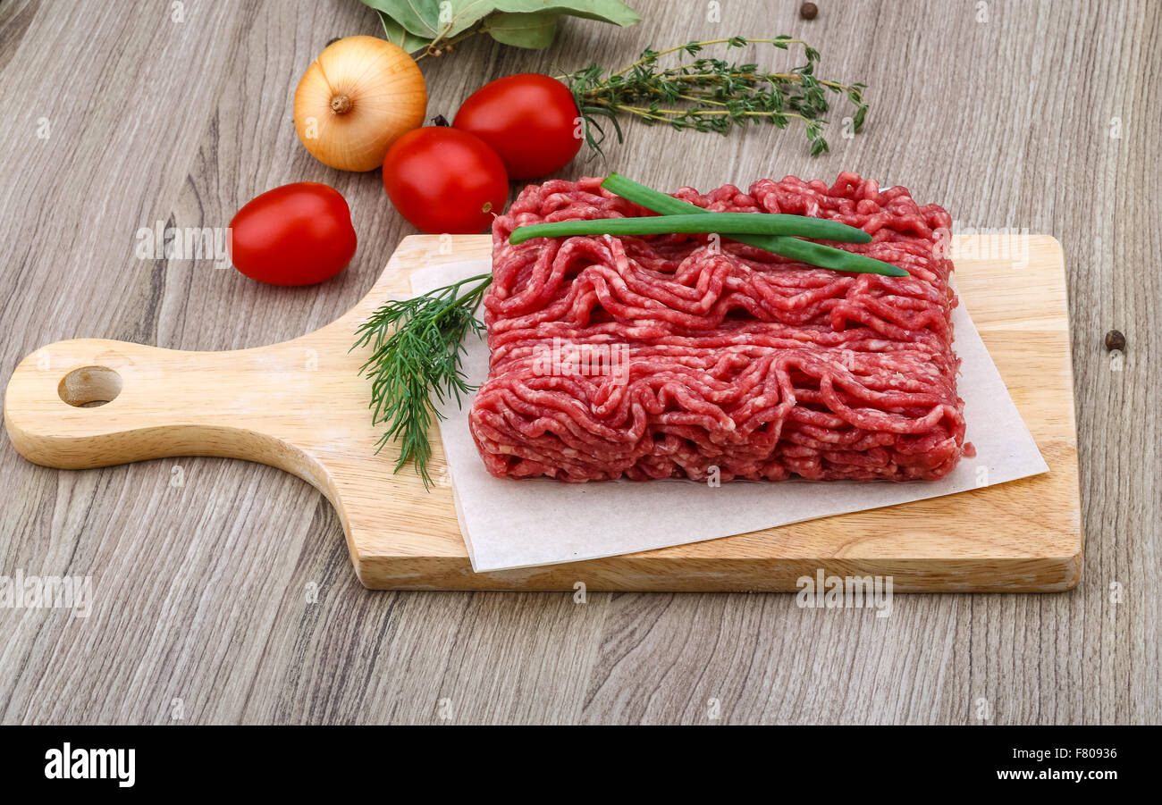 Raw minced beef meat with green oinion and dill Stock Photo - Alamy