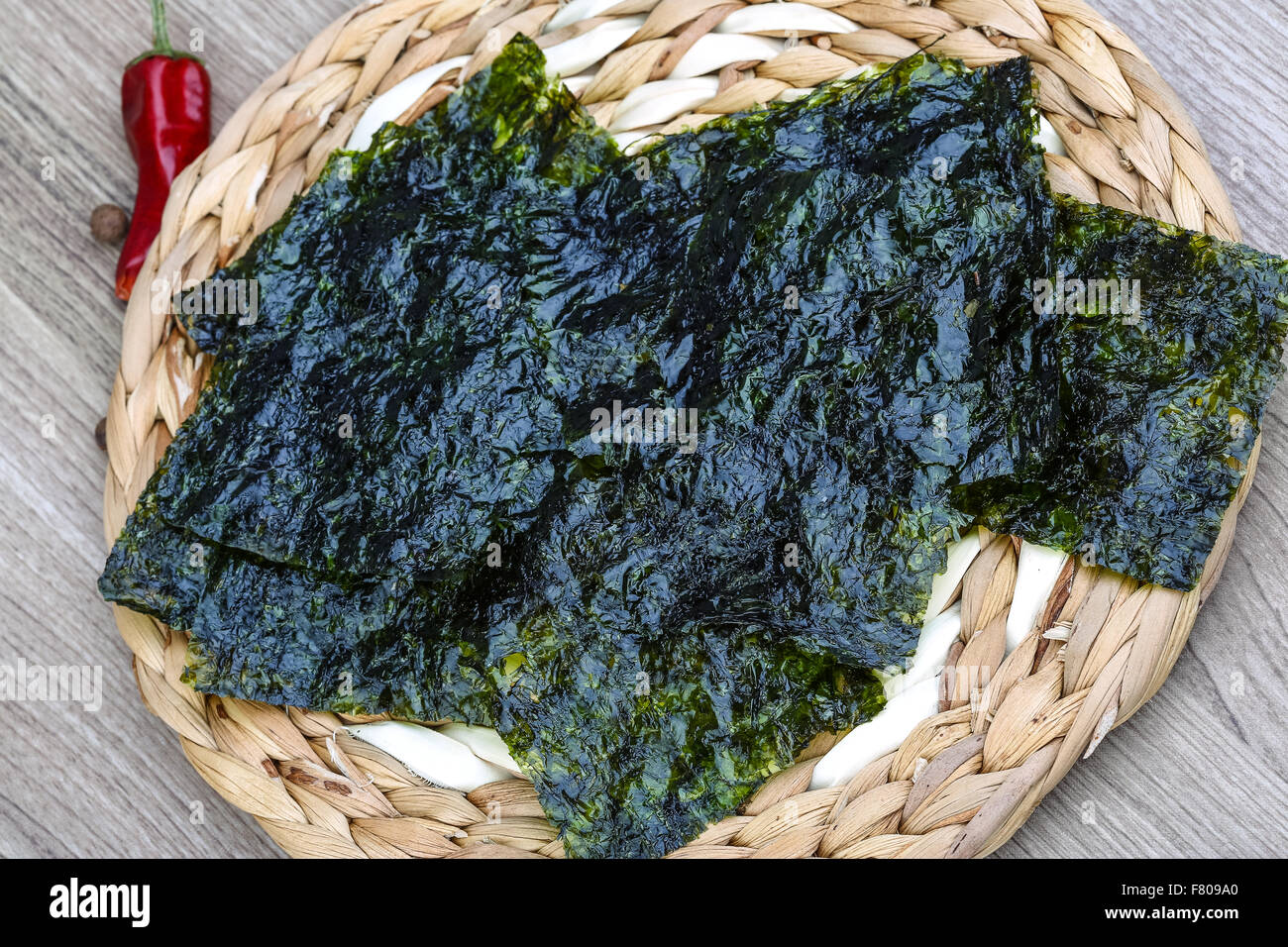 Korean traditional snack - Nori seaweed sheets on the wood background ...