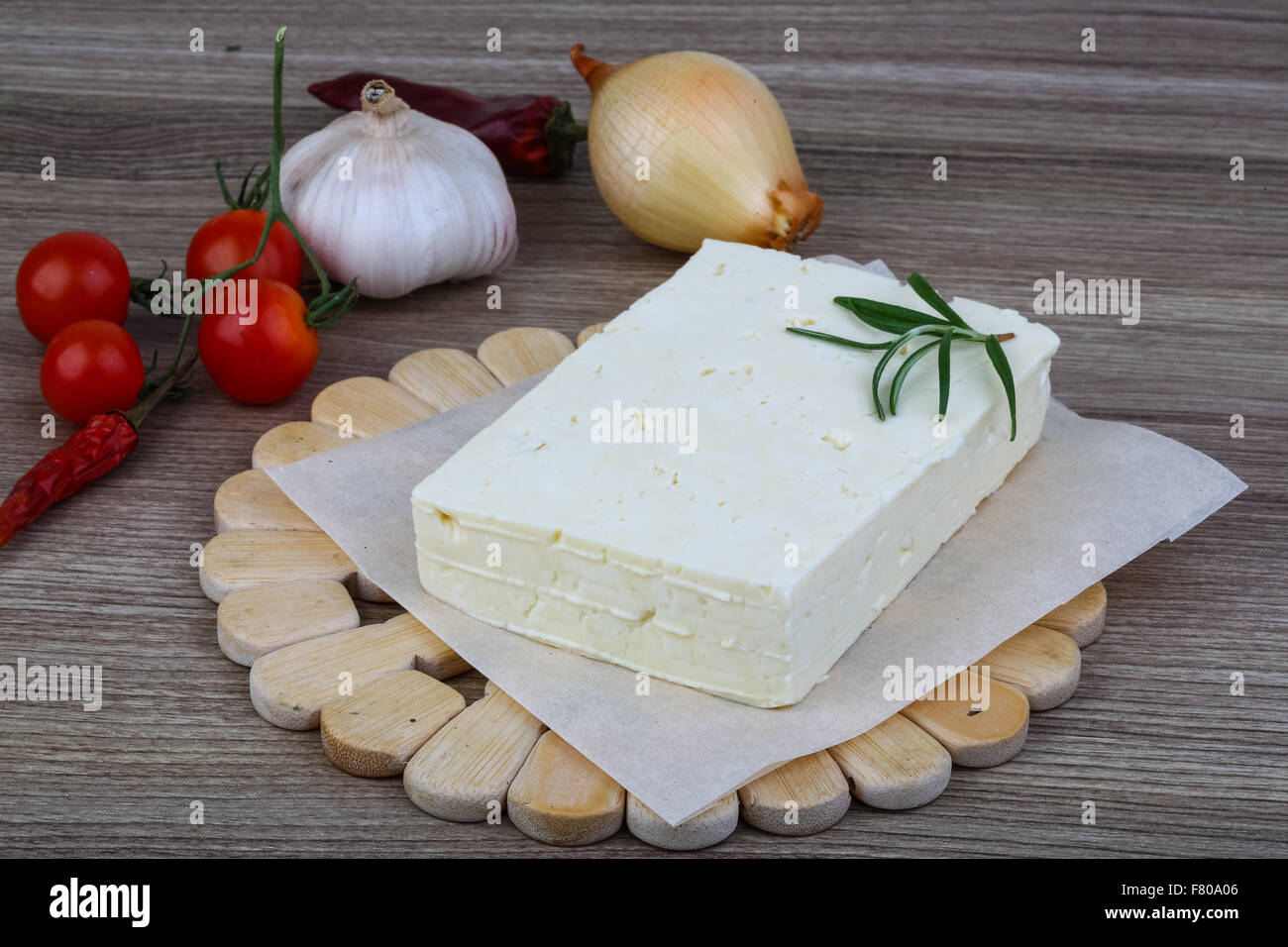 Traditional Caucasian homemade Cheese Brinza with rosemary on wood ...