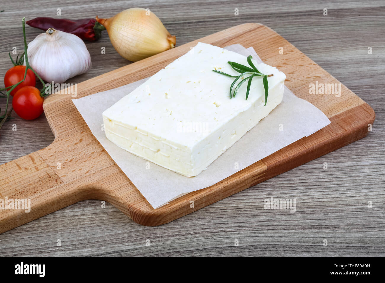 Traditional Caucasian homemade Cheese Brinza with rosemary on wood ...