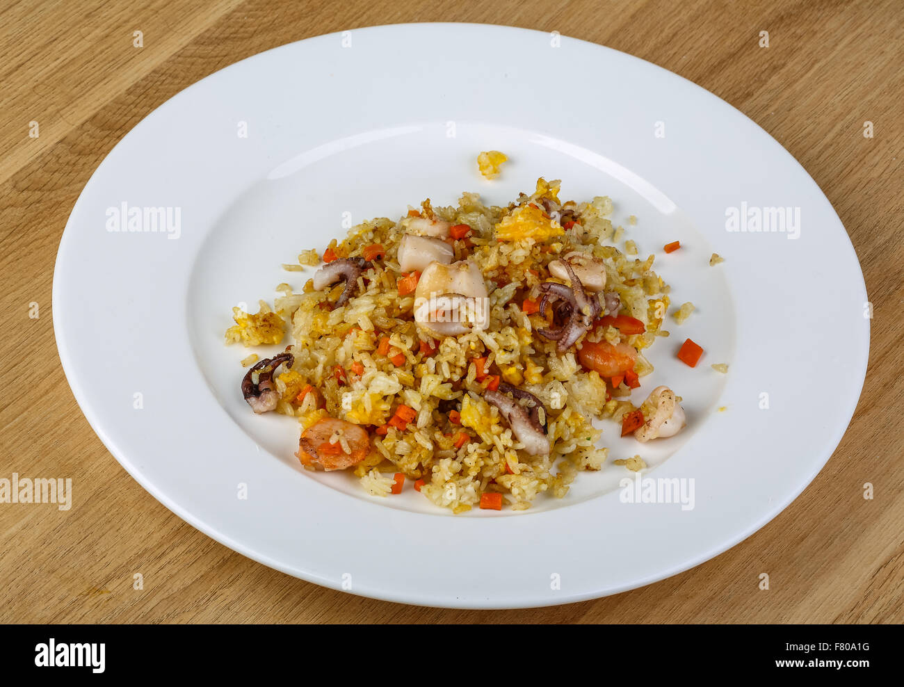 Asian traditional Fried rice with seafood on the wood background Stock ...