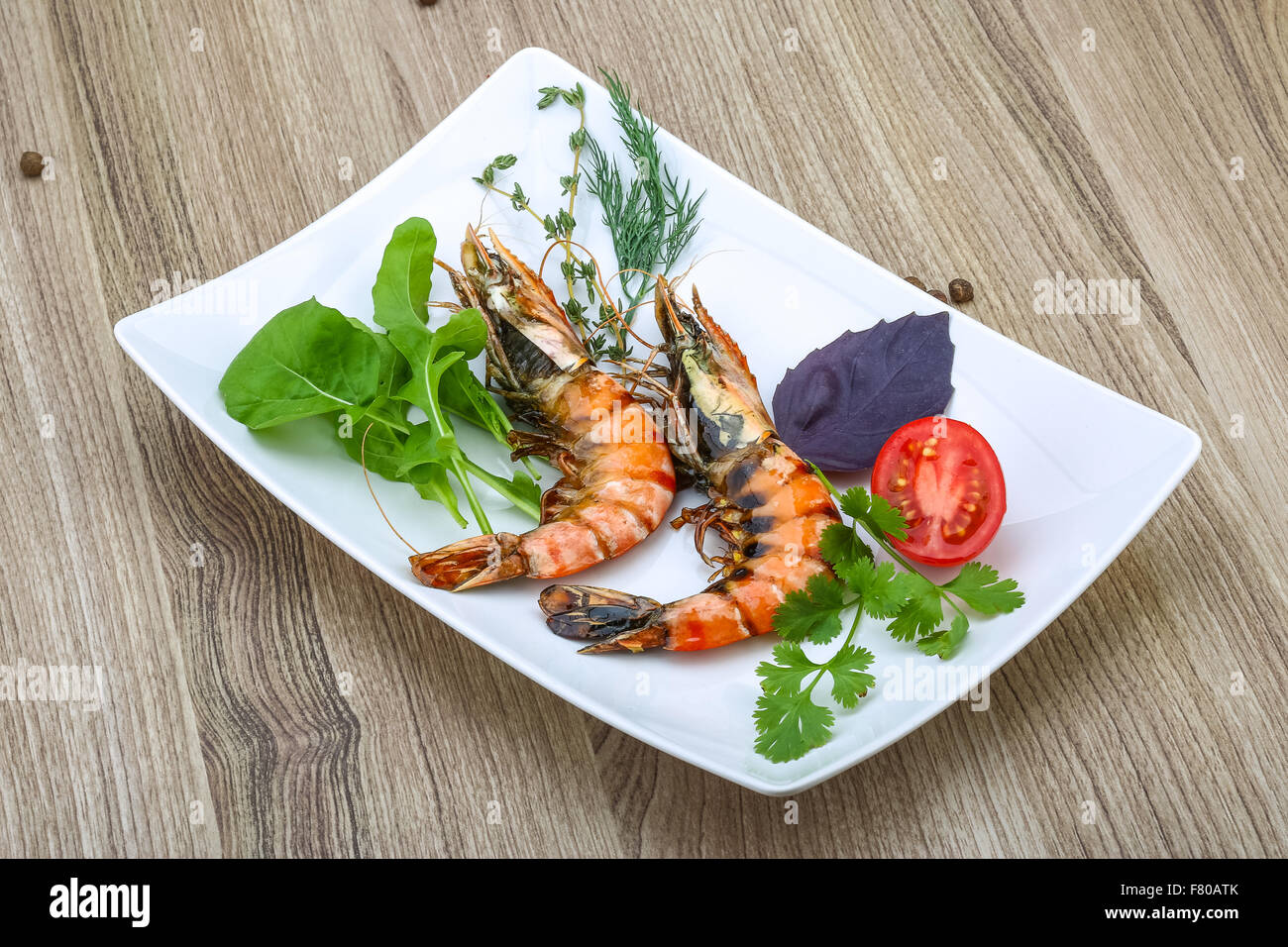 Roasted tiger shrimps with thyme and basil leaves Stock Photo - Alamy