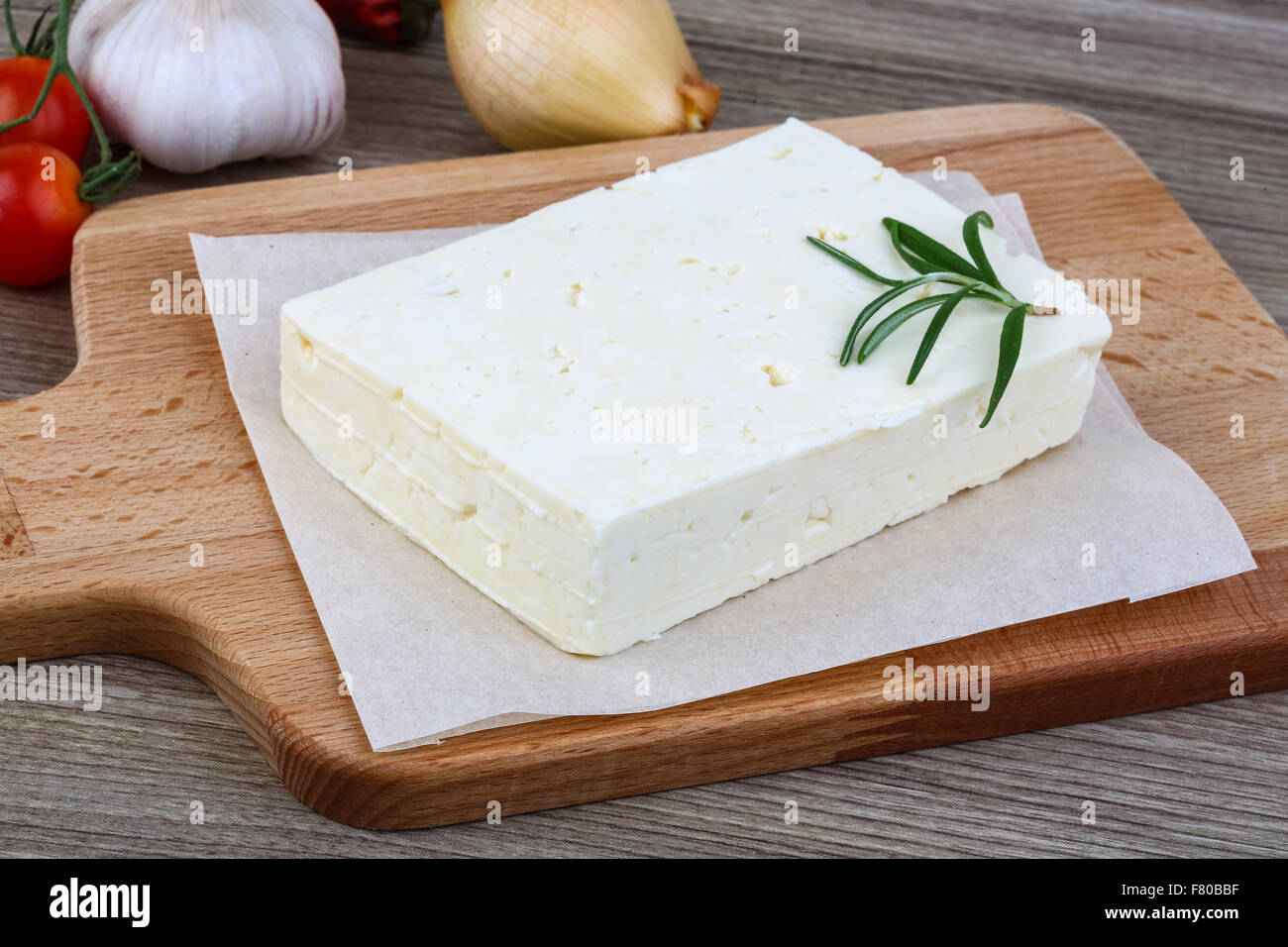 Traditional Caucasian homemade Cheese Brinza with rosemary on wood ...