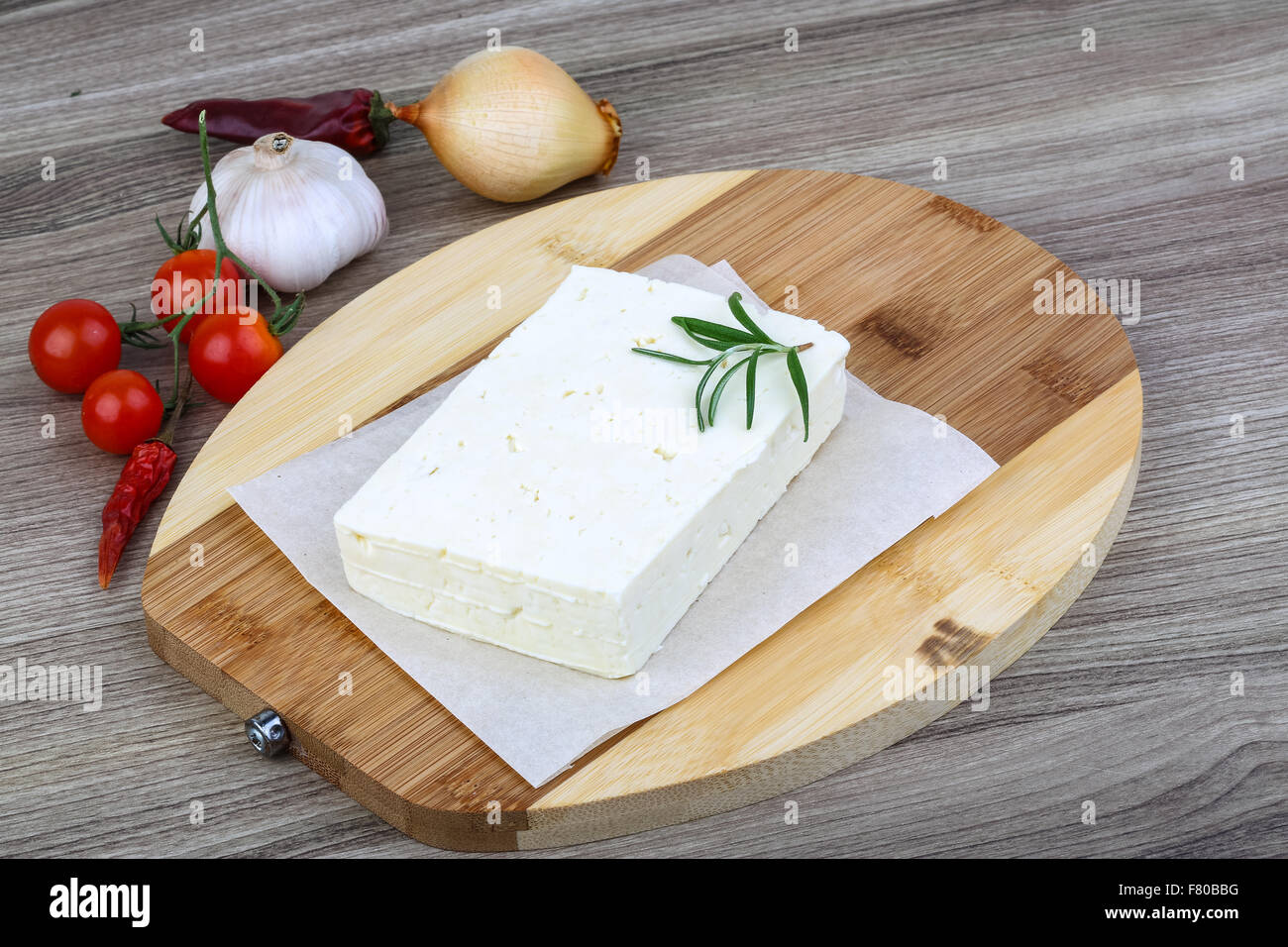 Traditional Caucasian homemade Cheese Brinza with rosemary on wood ...