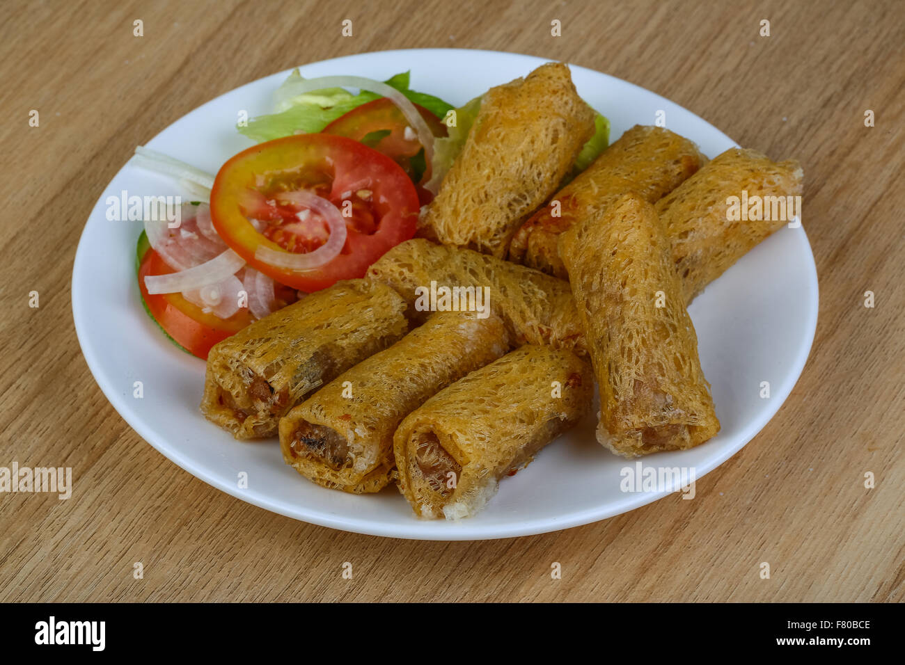 Asian traditional spring rolls on the wood background Stock Photo - Alamy