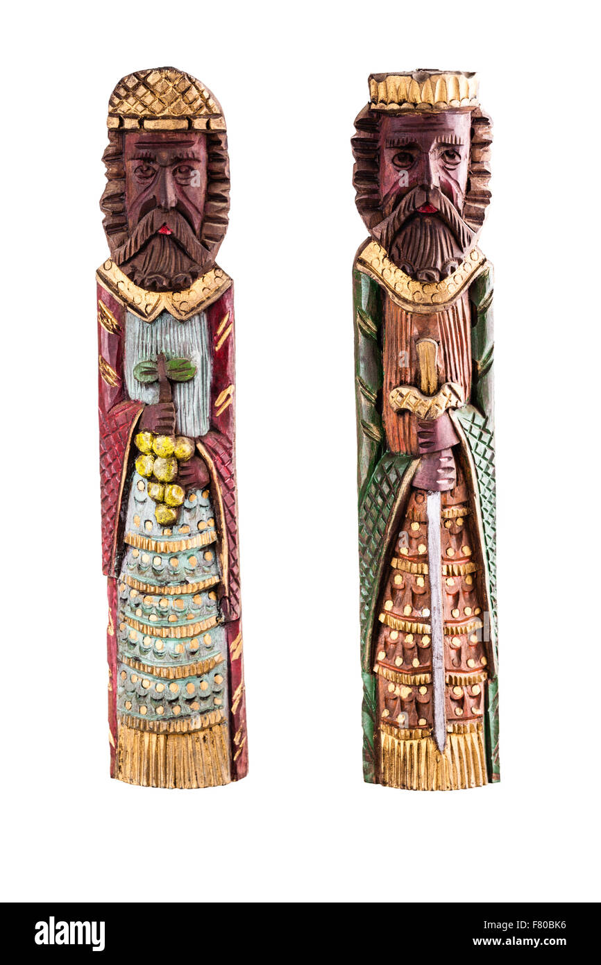 two wooden sculpture depicting two medieval kings isolated over a white ...