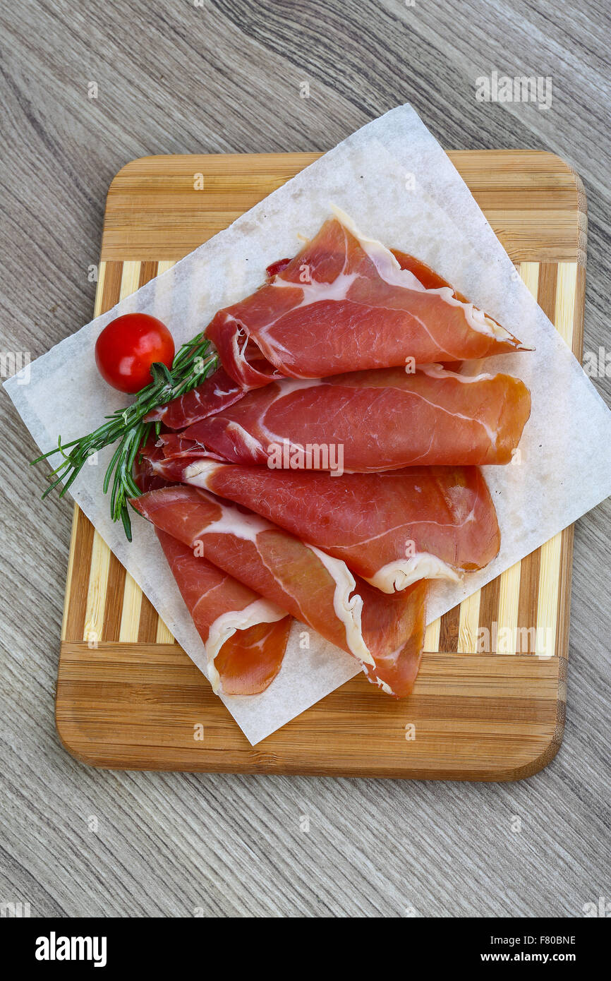 Spanish traditional snack - Jamon with tomato and rosemary Stock Photo ...