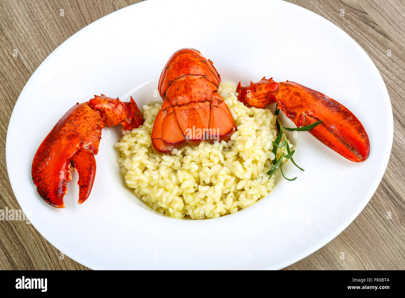 Delicous Risotto with lobster served rosemary and parmesan Stock Photo ...