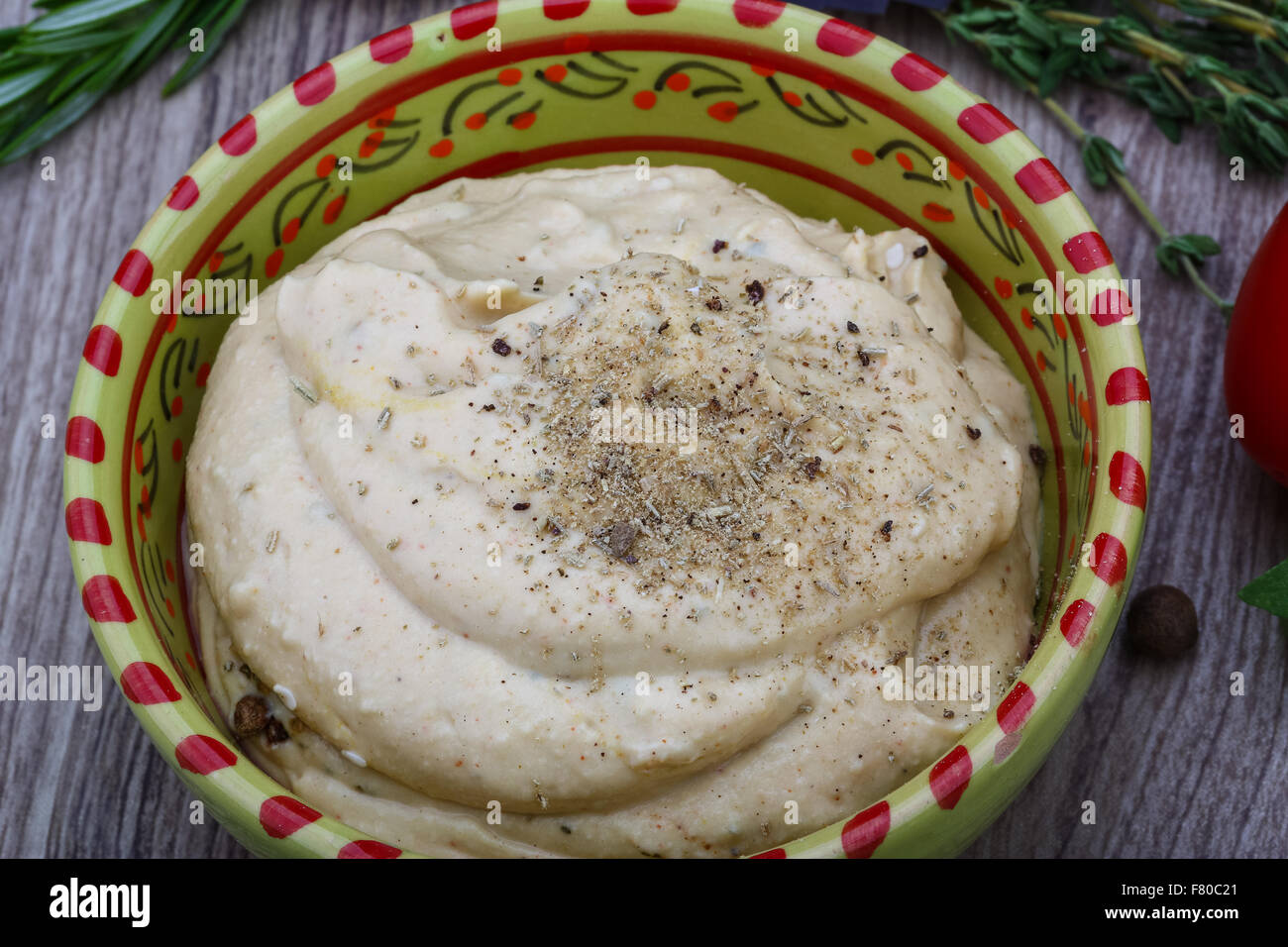 Arabic traditional cusine - hummus with olive oil, herbs and spices ...