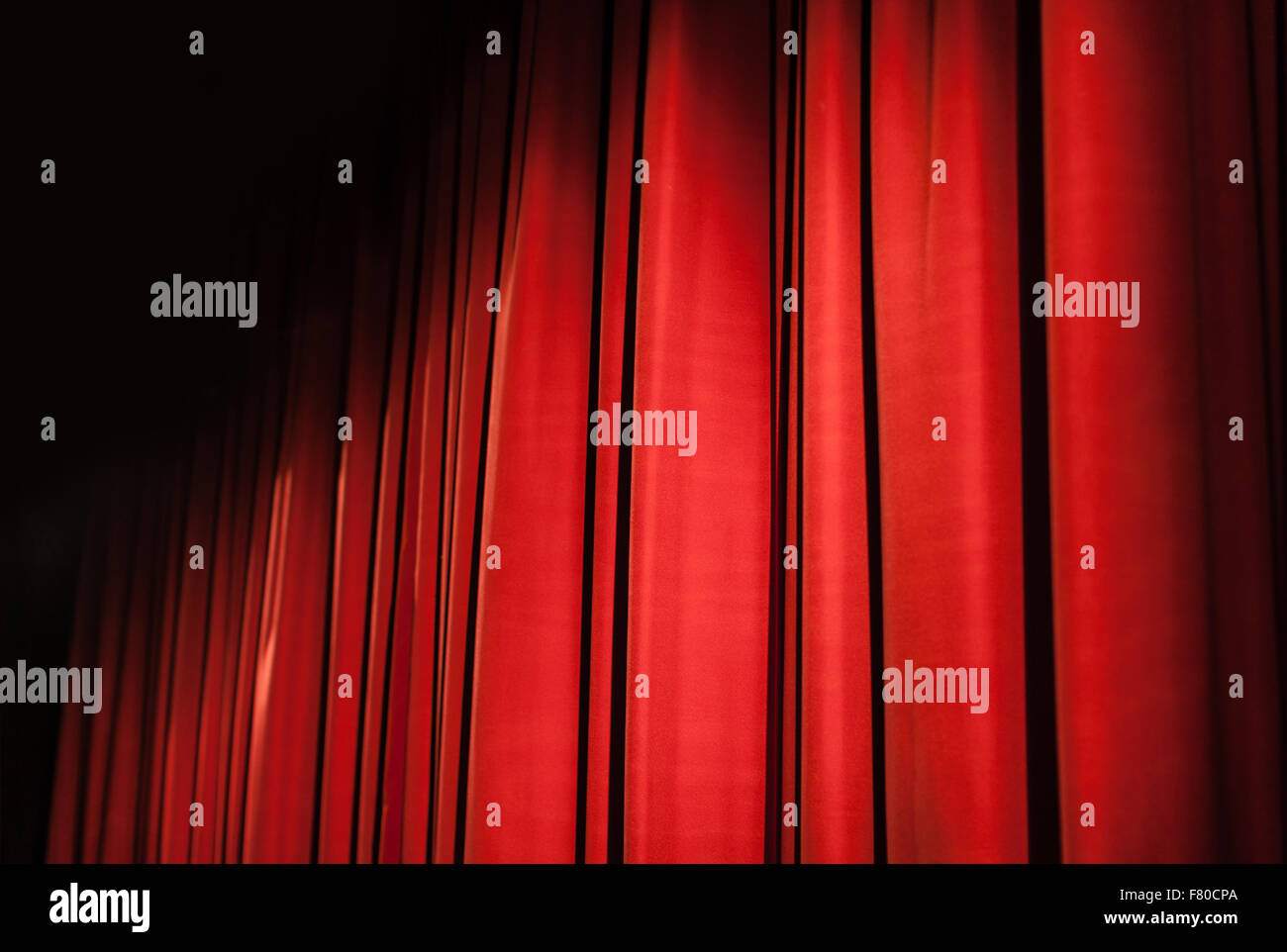 a closed red stage curtain in a small theater Stock Photo - Alamy